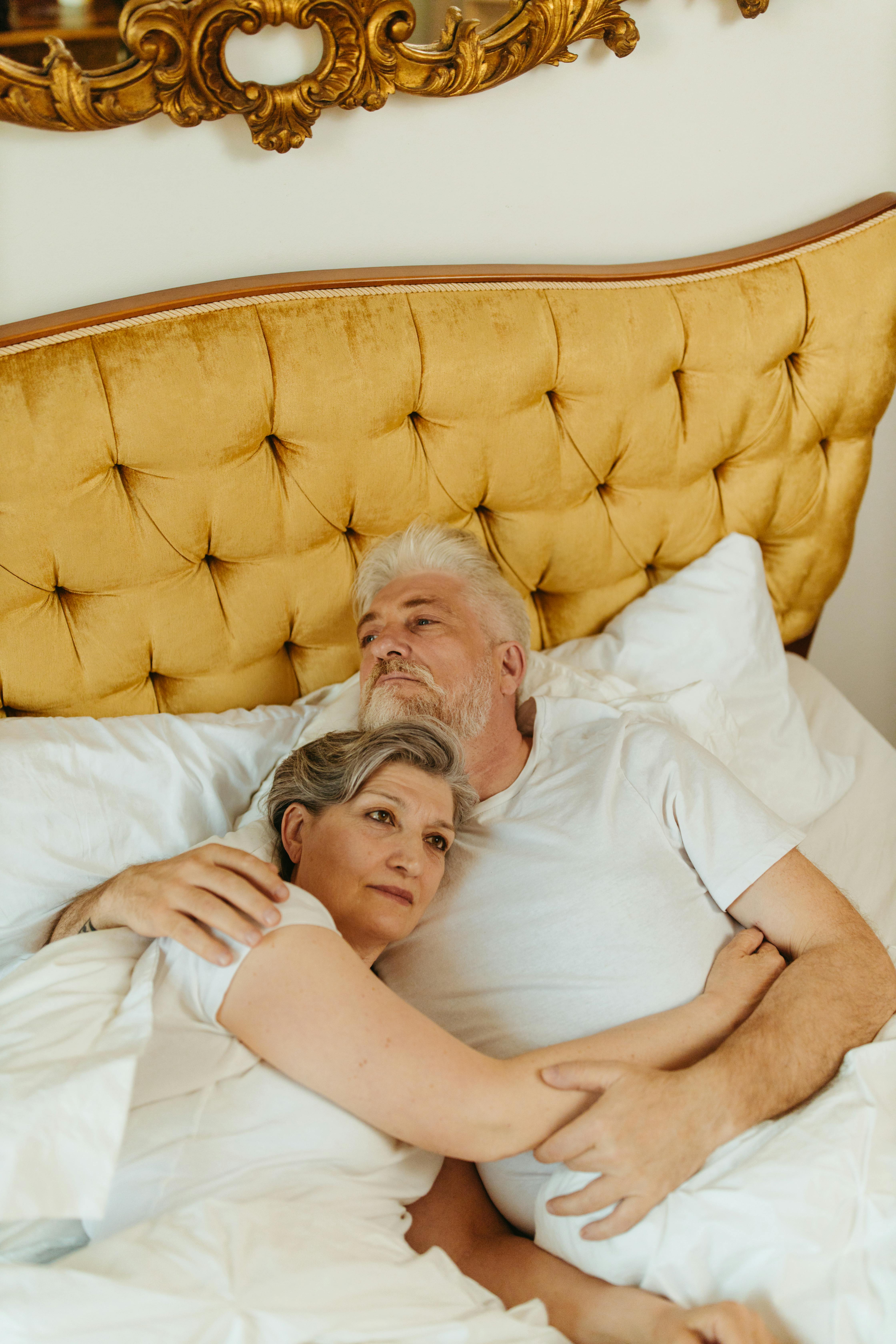 Sweet Adult Couple Lying on Bed · Free Stock Photo