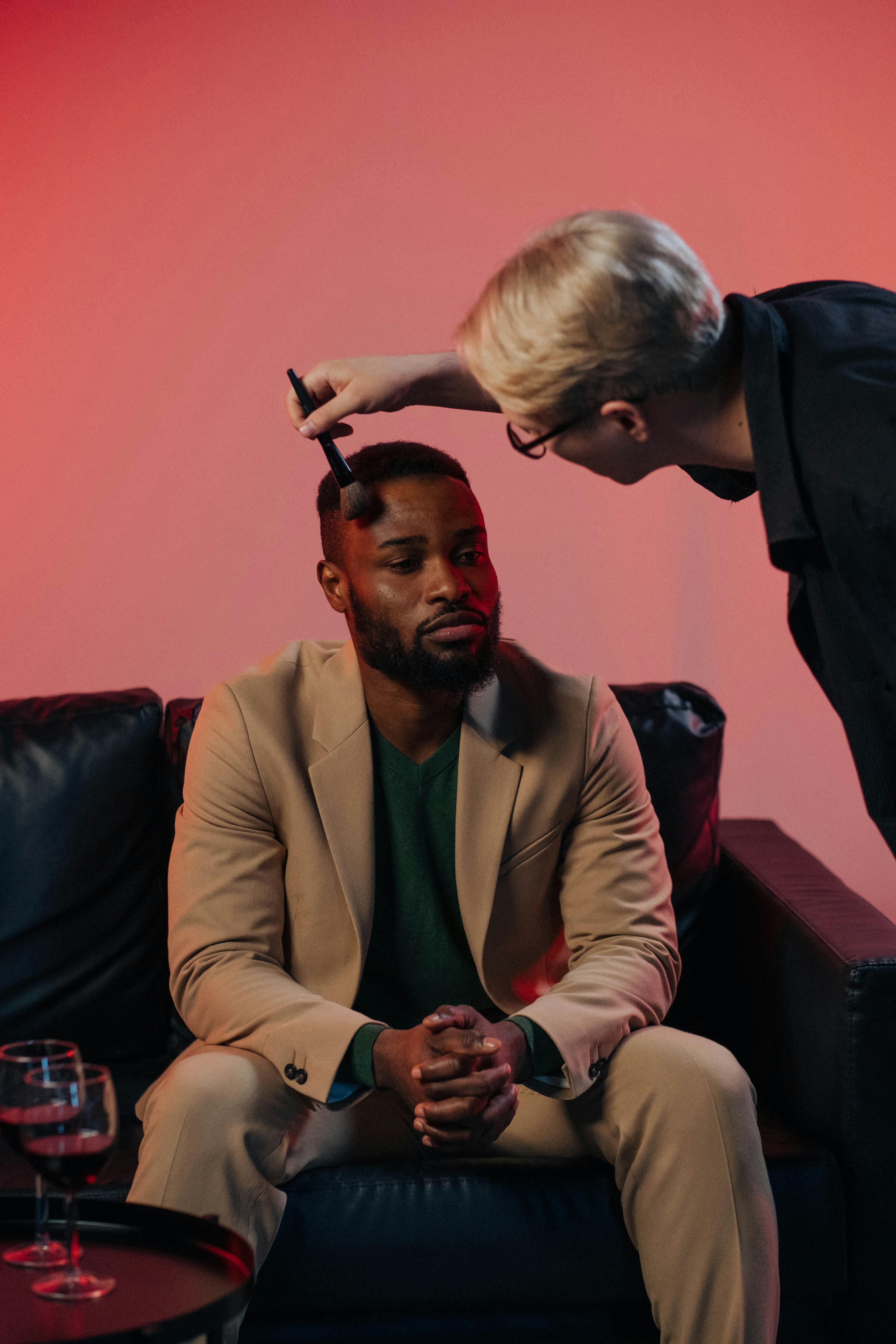 Man Applying Makeup to Actor Face · Free Stock Photo