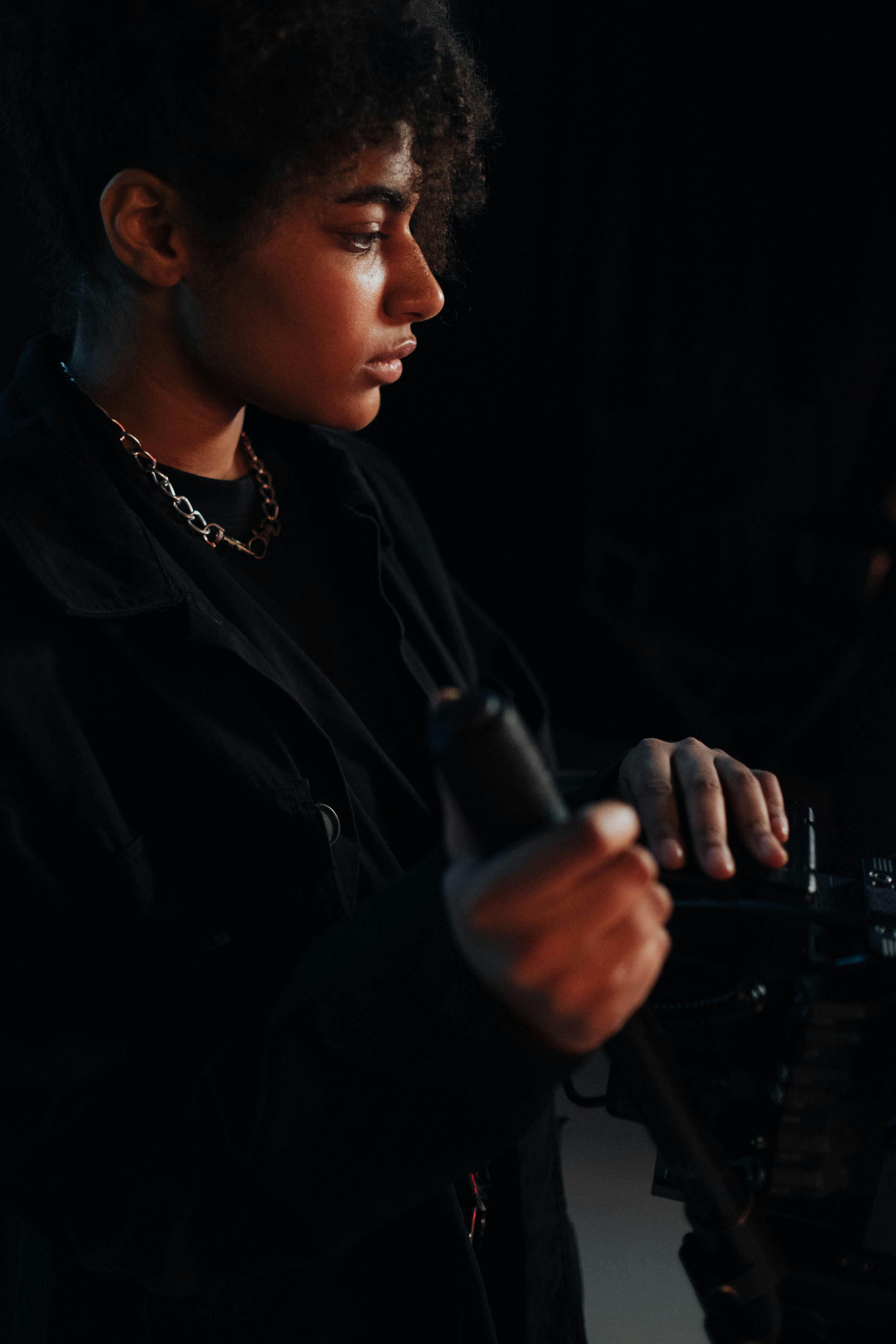 Brunette Woman Working as Camera Operator · Free Stock Photo