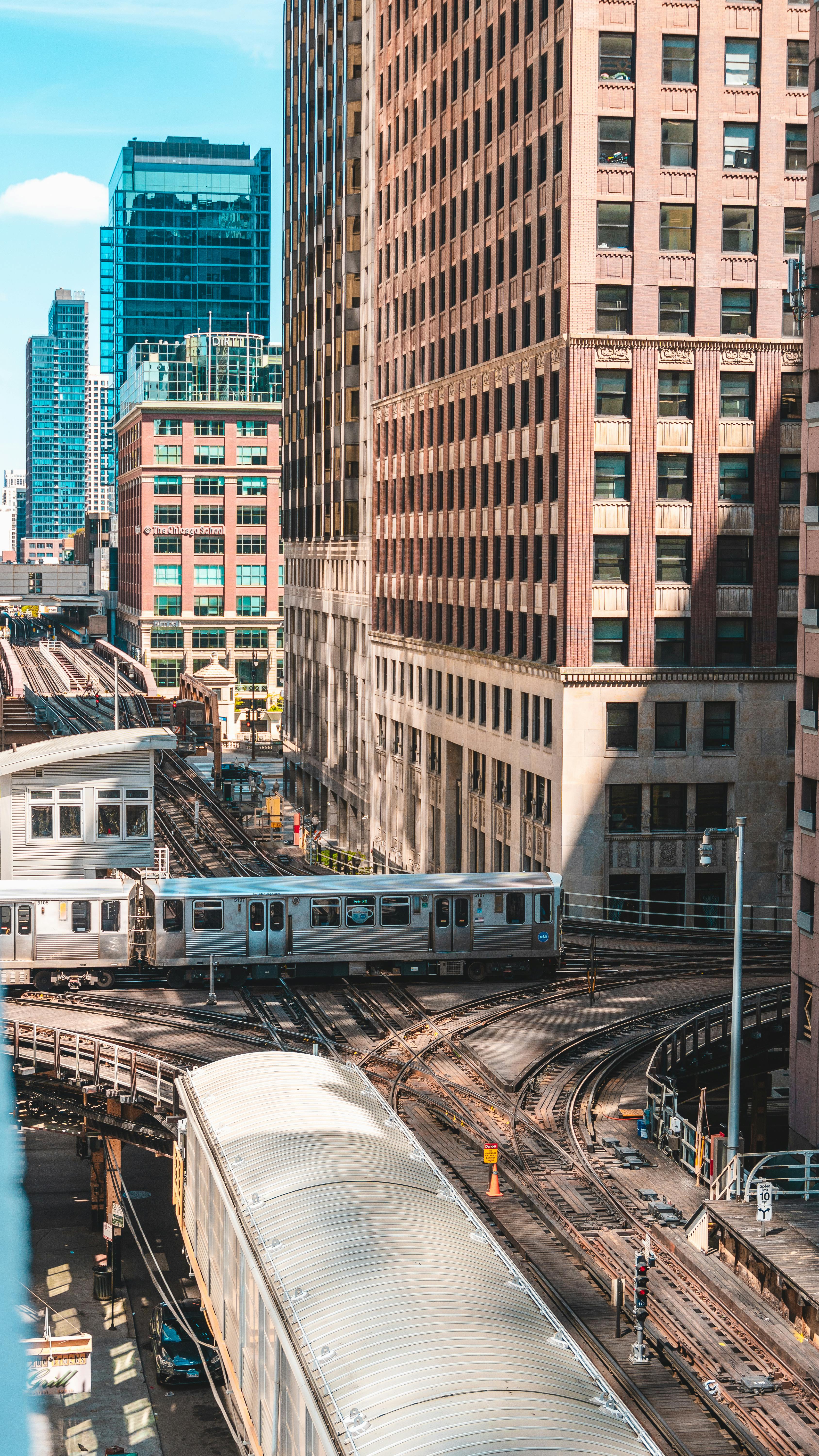 People Enjoying the Beach Near High Rise Buildings · Free Stock Photo