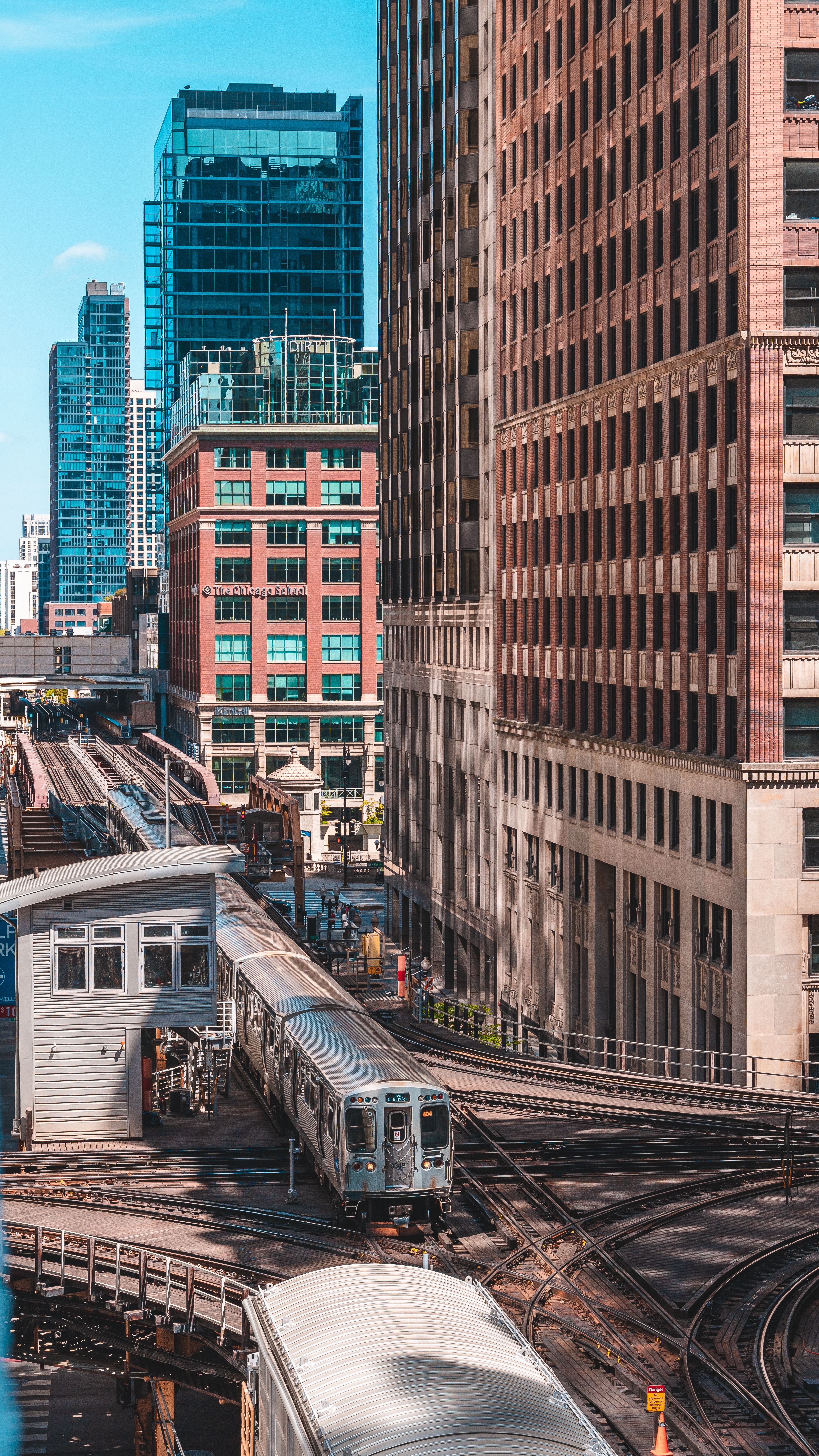 An Aerial Photography of a Moving Train Near the Buildings · Free Stock ...