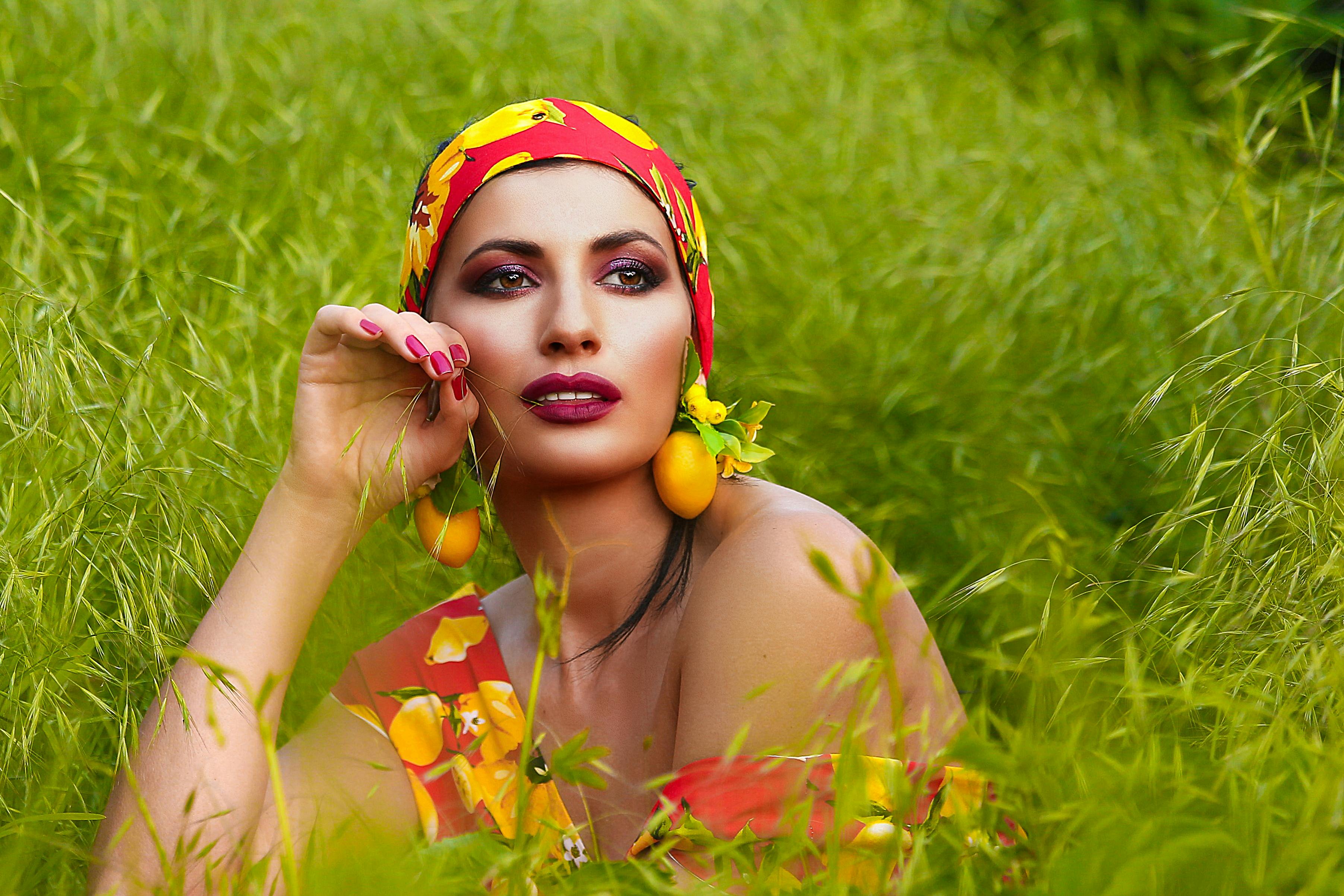 Elegant Woman in Red Headscarf and Red Off Shoulder Top · Free Stock Photo