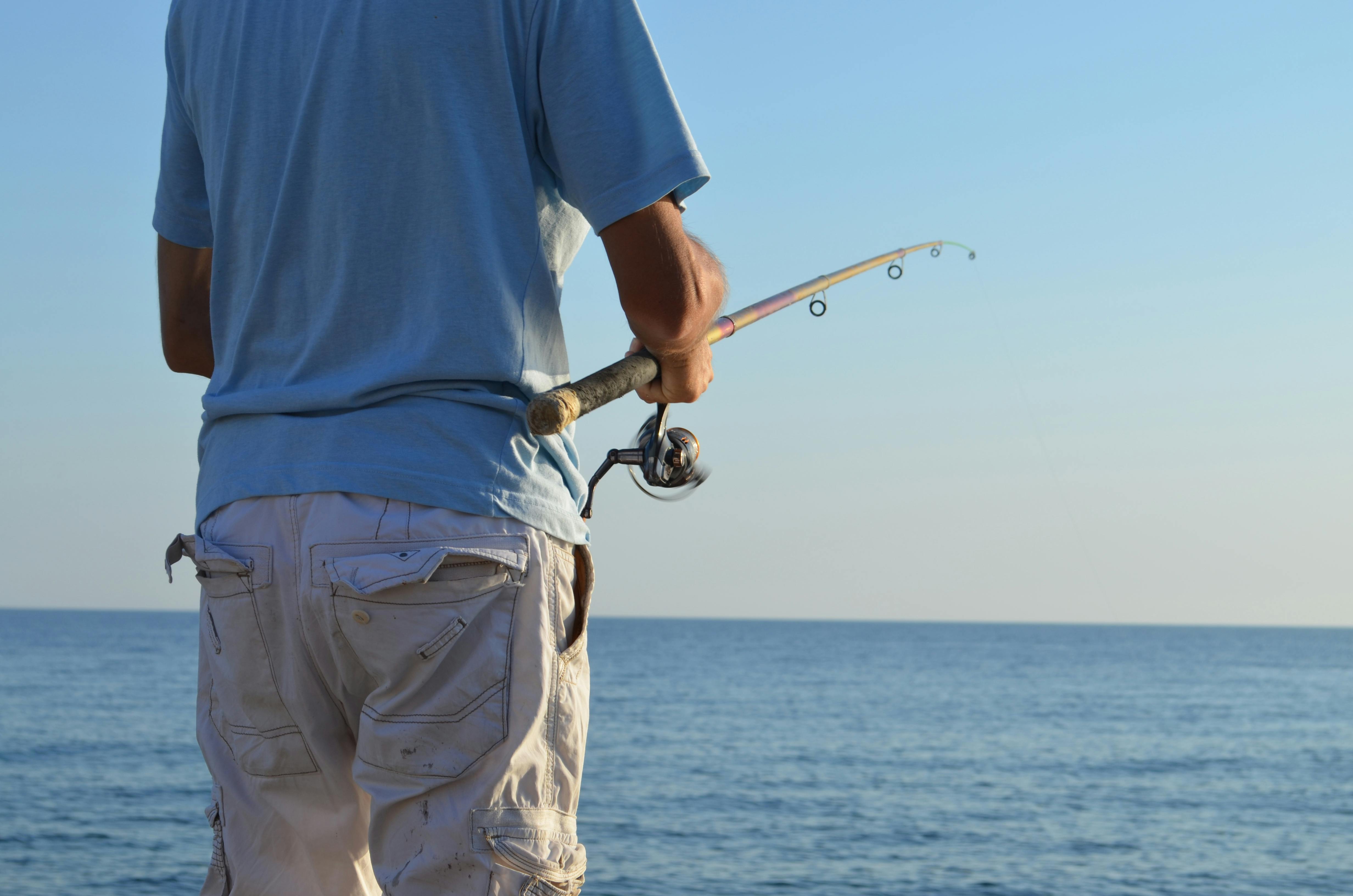 A Person Using a Fishing Rod · Free Stock Photo
