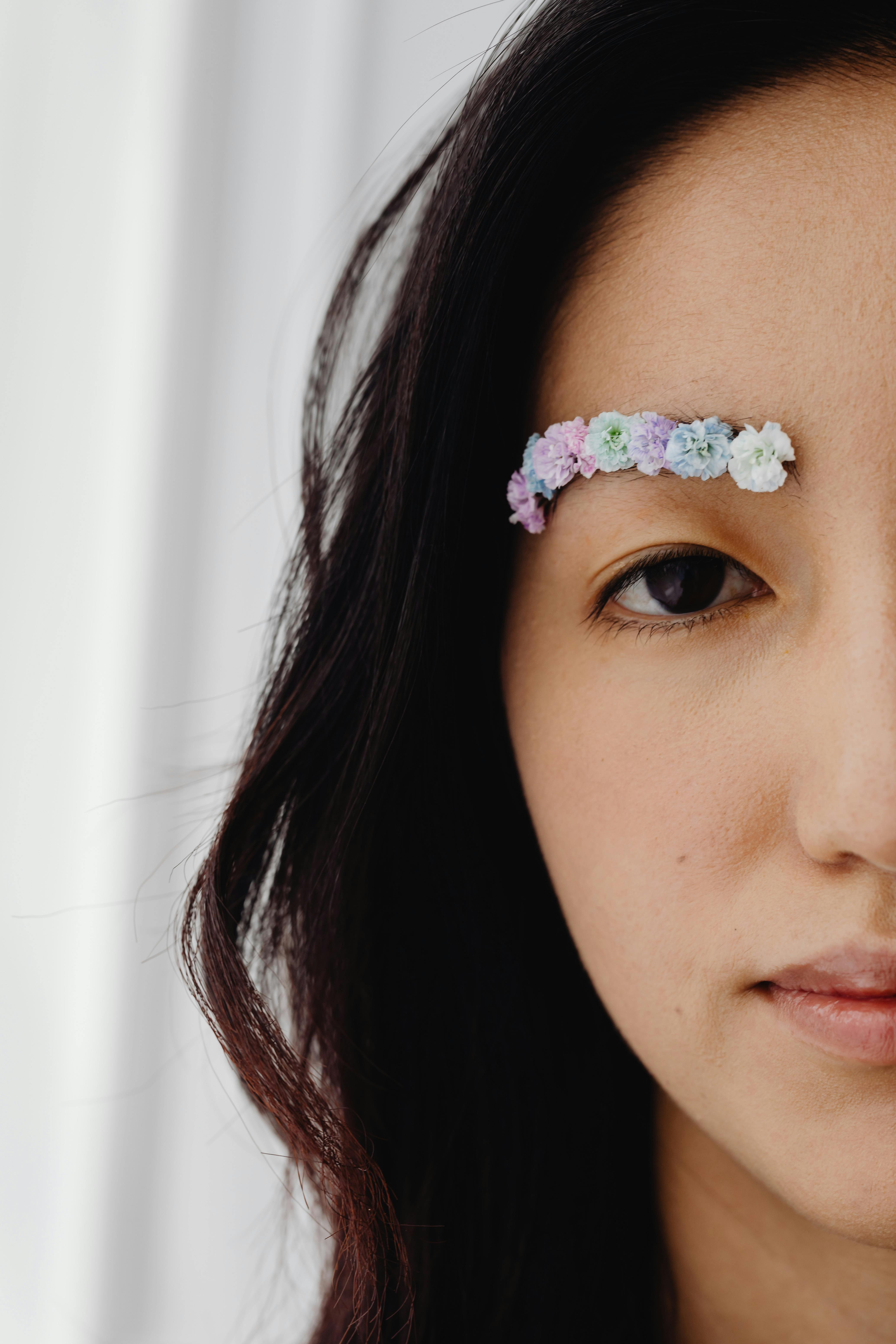 Woman with Purple and White Flowers on Eyebrow · Free Stock Photo