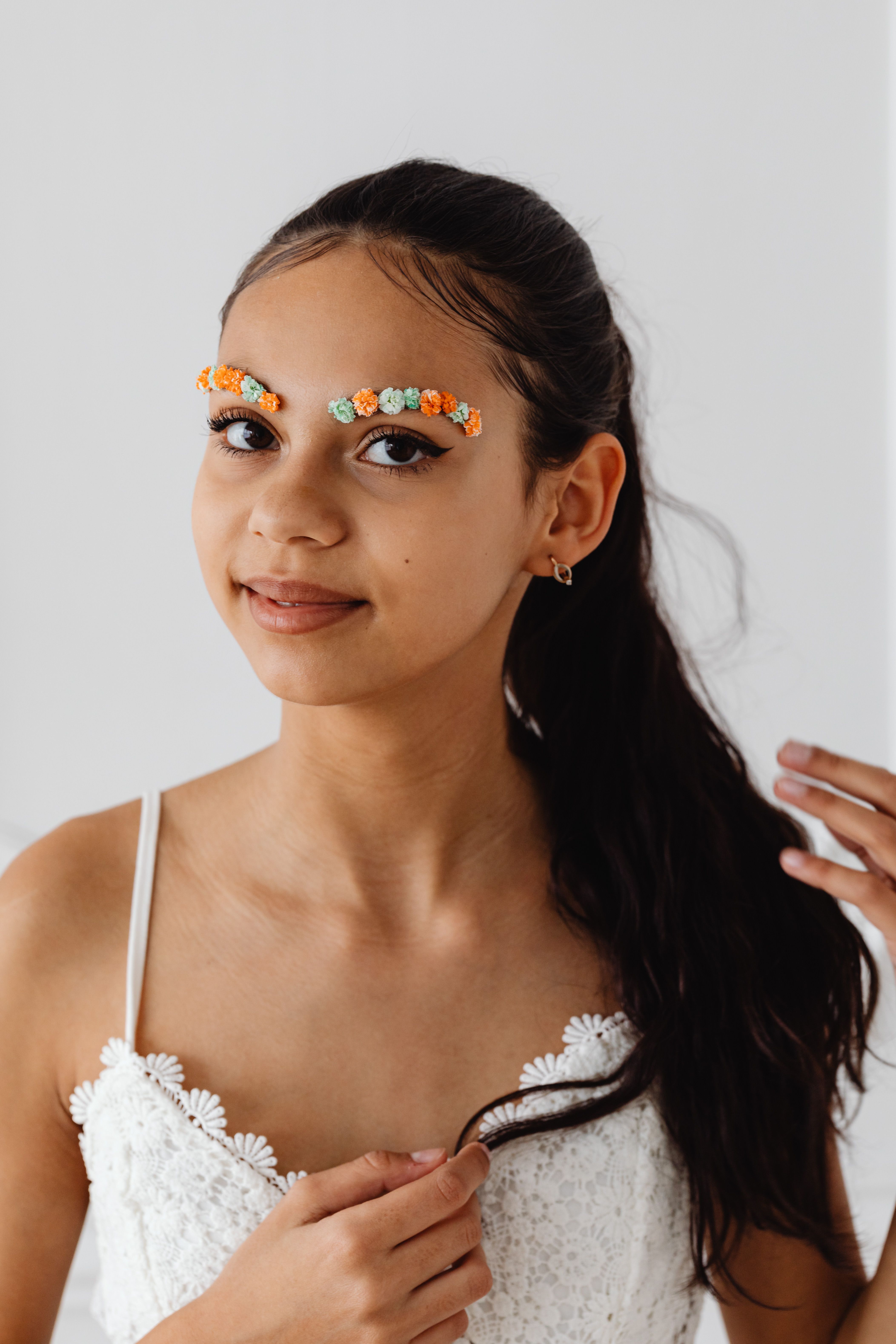A Woman with Flowers on Her Eyebrows · Free Stock Photo