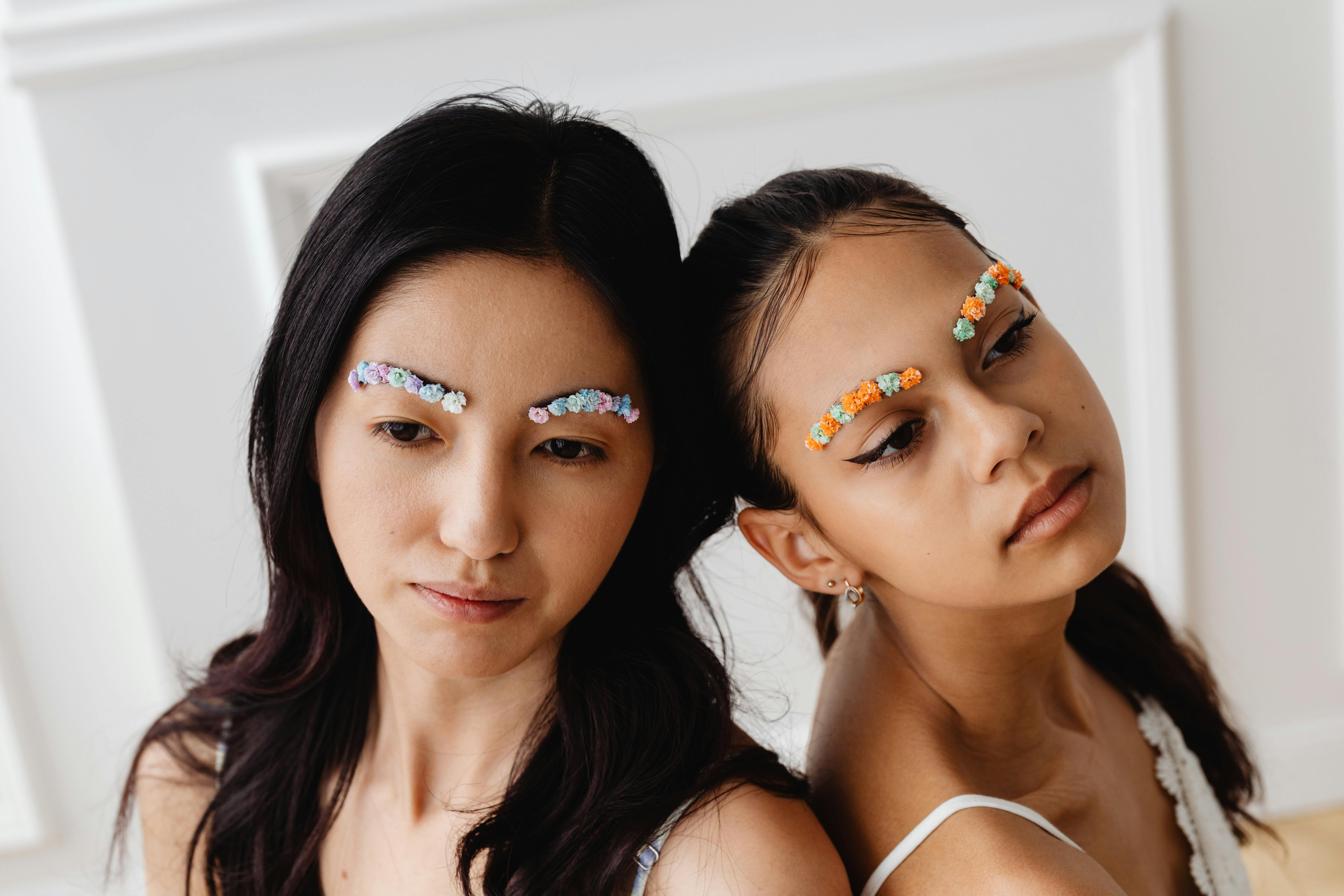 Women With Flower Decoration on Eyebrows · Free Stock Photo