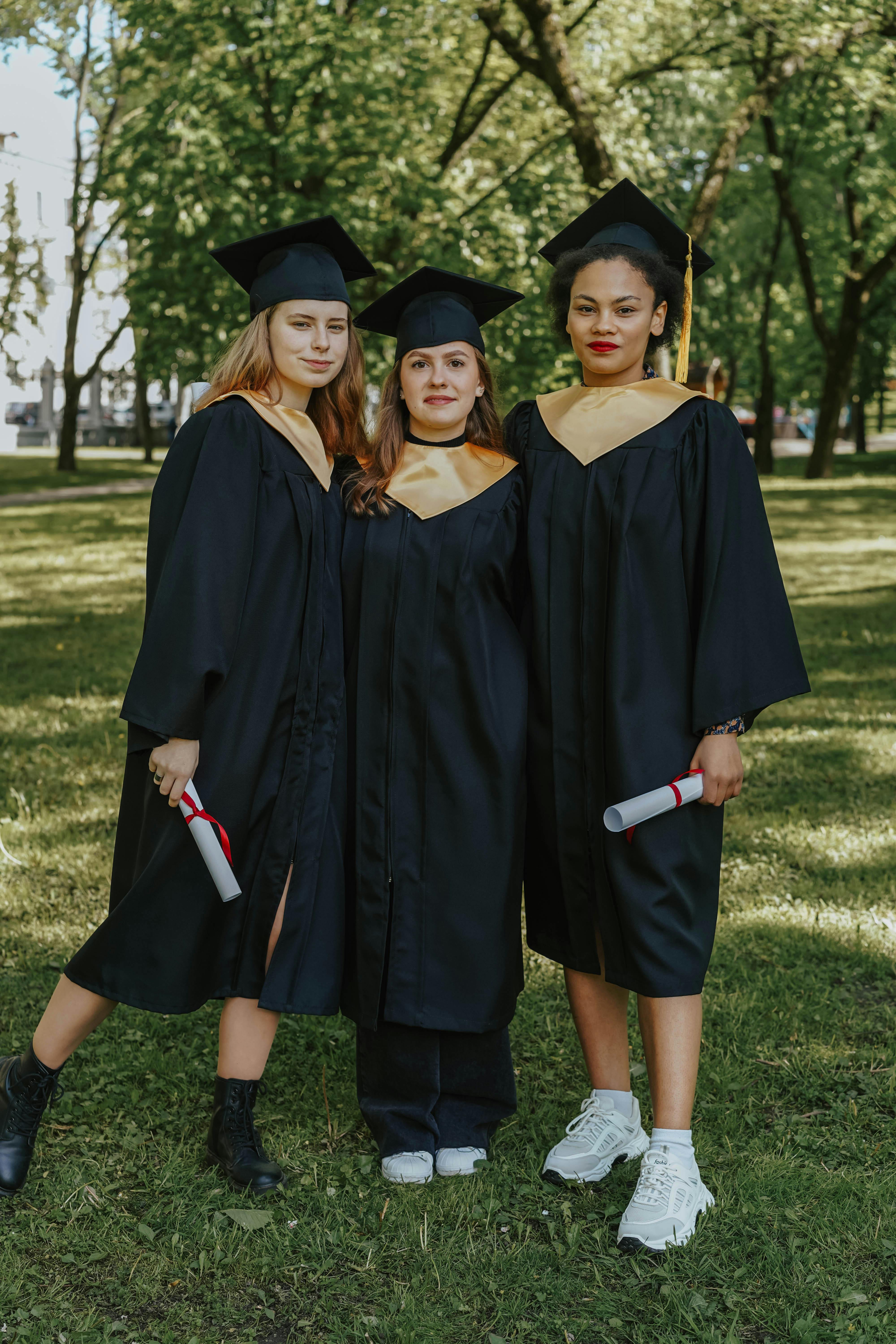 Three Girls in Black Graduation Gown · Free Stock Photo