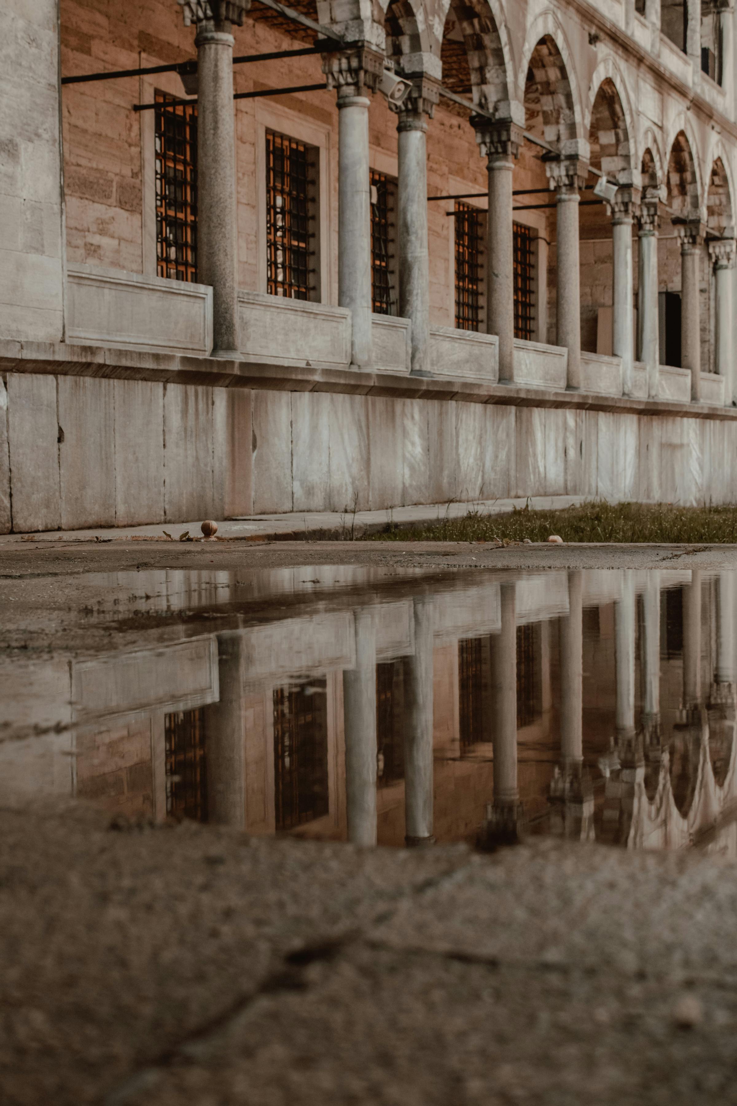 Old Concrete Building with Arches and Columns · Free Stock Photo