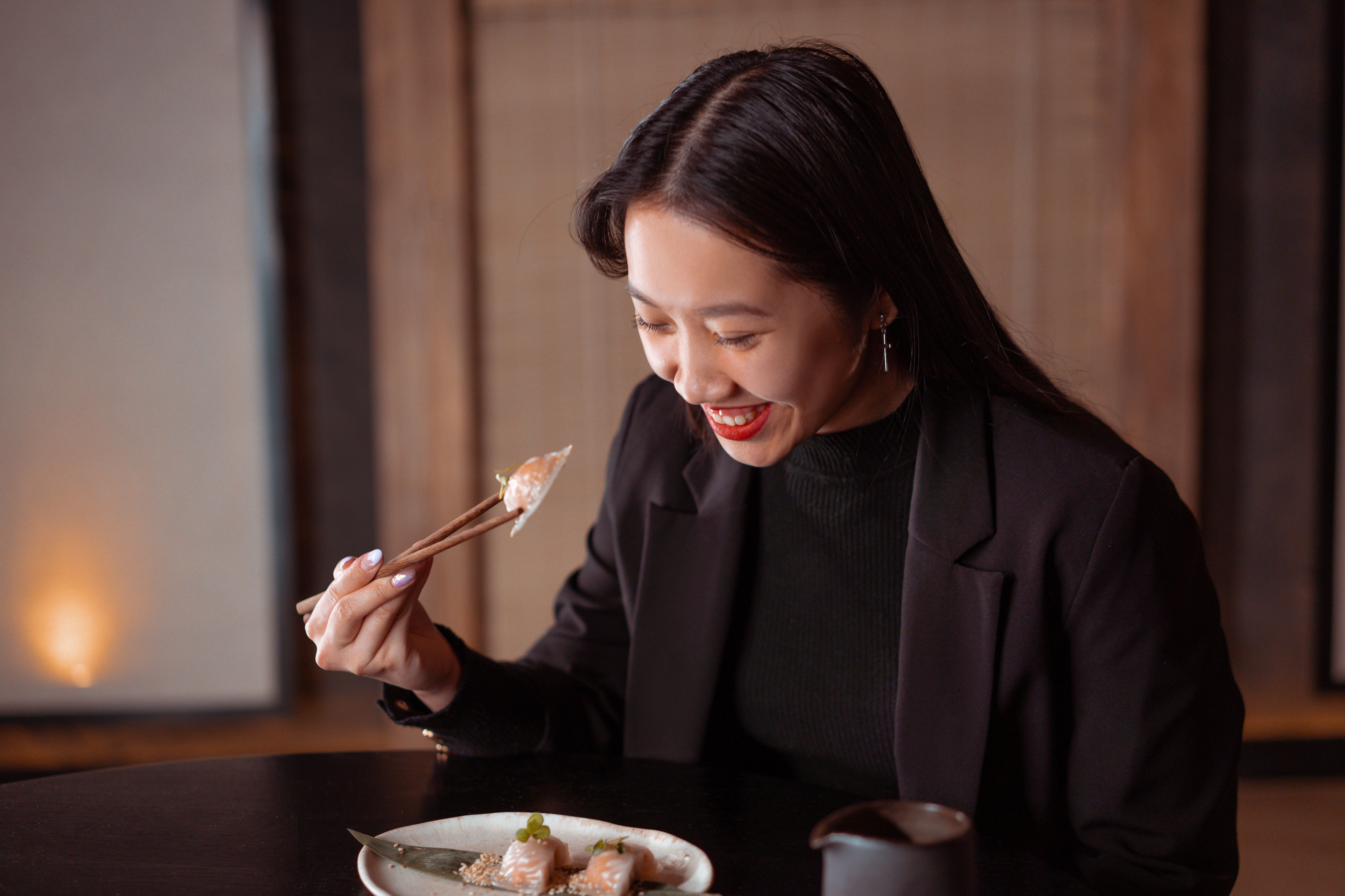 Woman Holding Chopsticks · Free Stock Photo