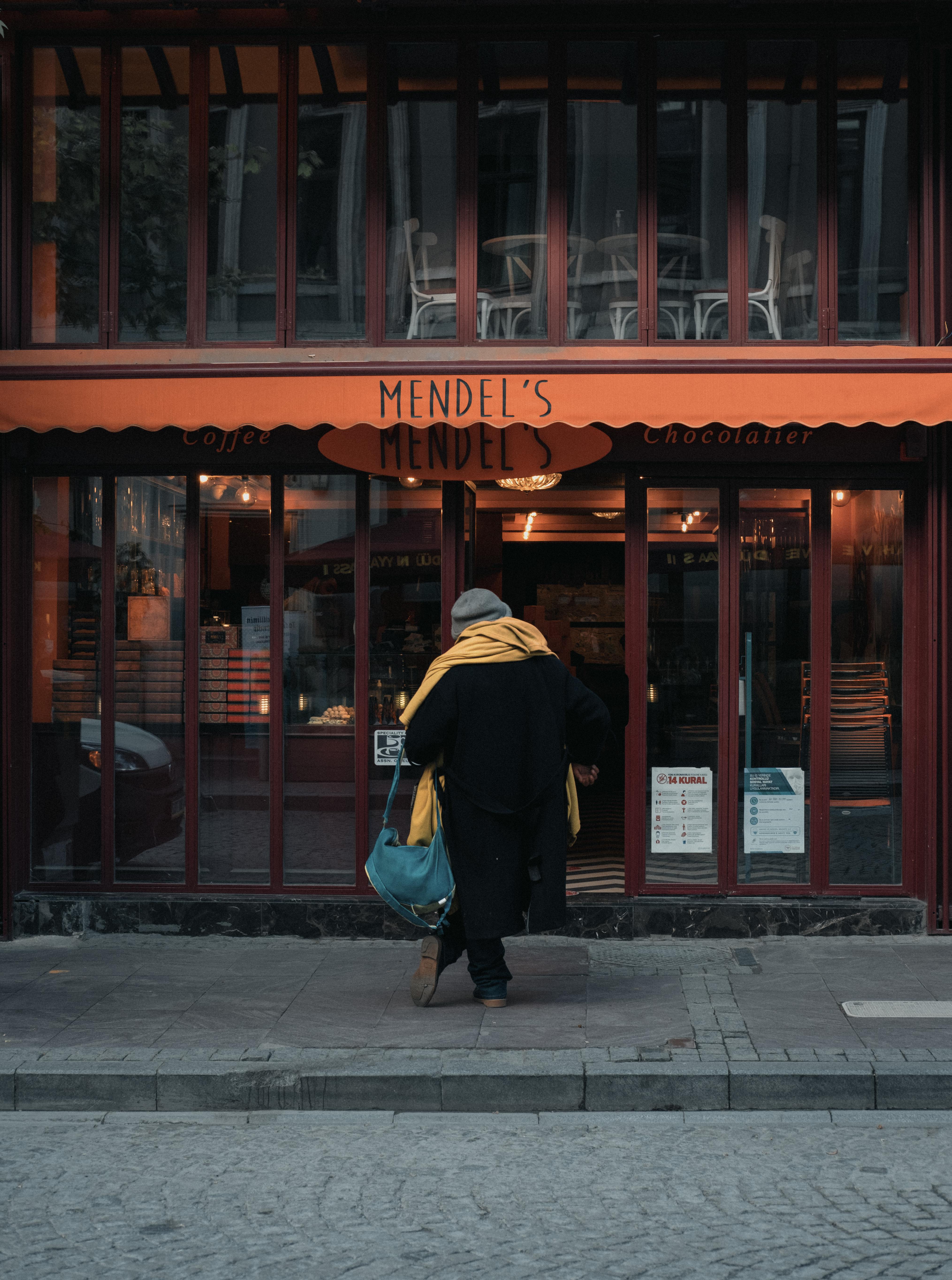 Elegant man walking on street in city district · Free Stock Photo