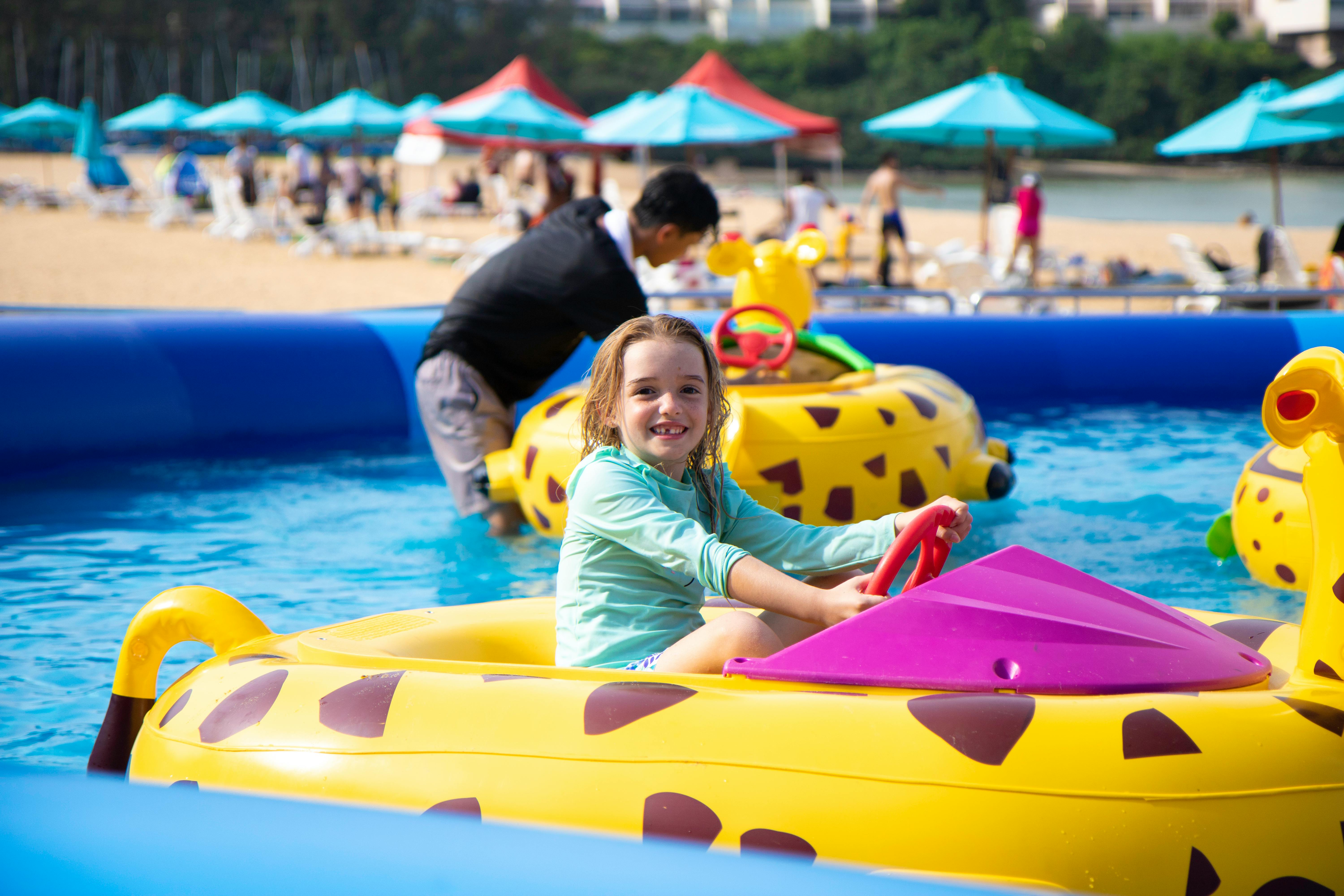A Girl Riding a Floater on the Pool · Free Stock Photo