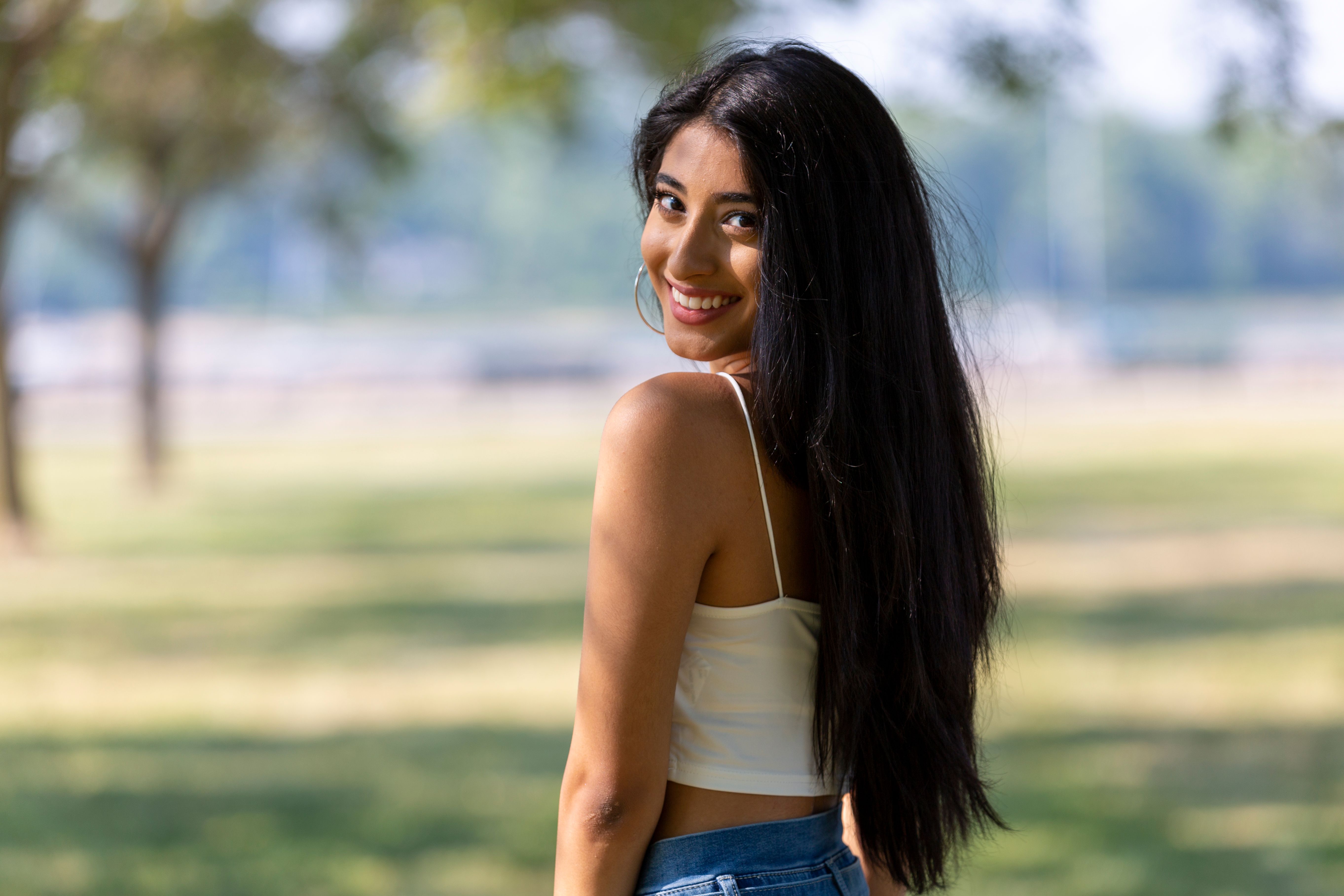 Back View of a Woman in Beige Tank Top · Free Stock Photo
