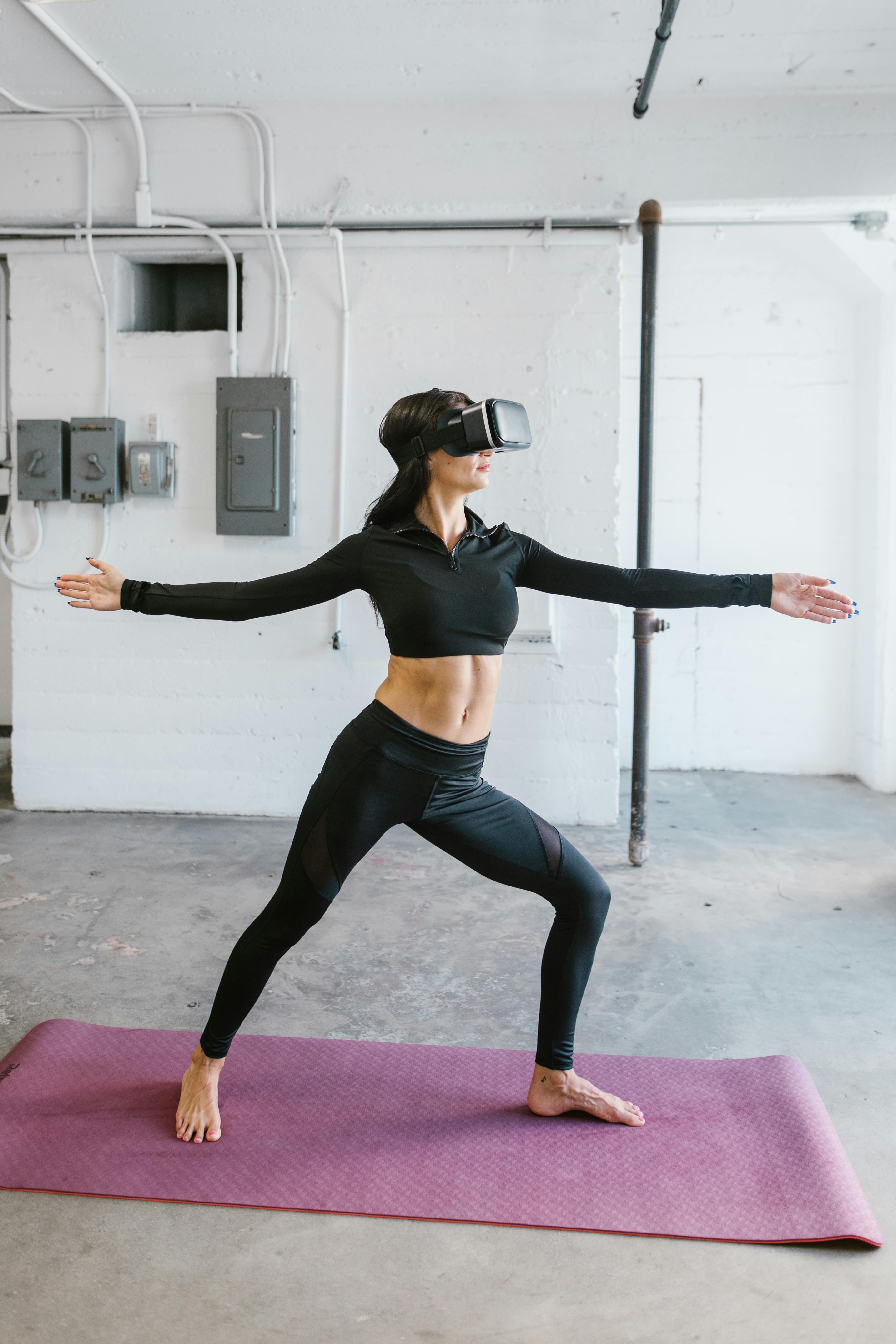 Woman with Virtual Reality Goggles on a Yoga Mat · Free Stock Photo