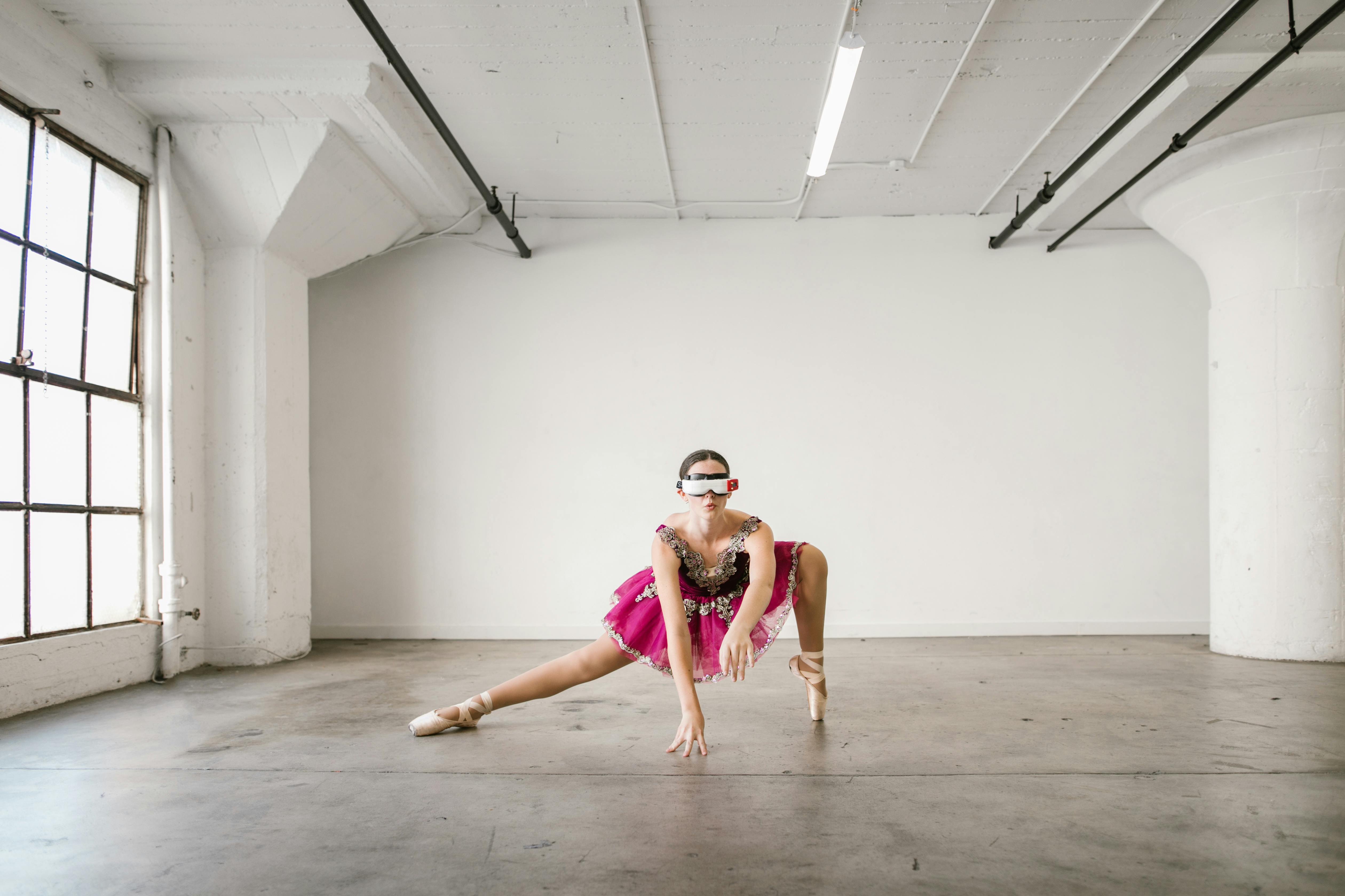Woman in Ballet Pose Touching Floor · Free Stock Photo