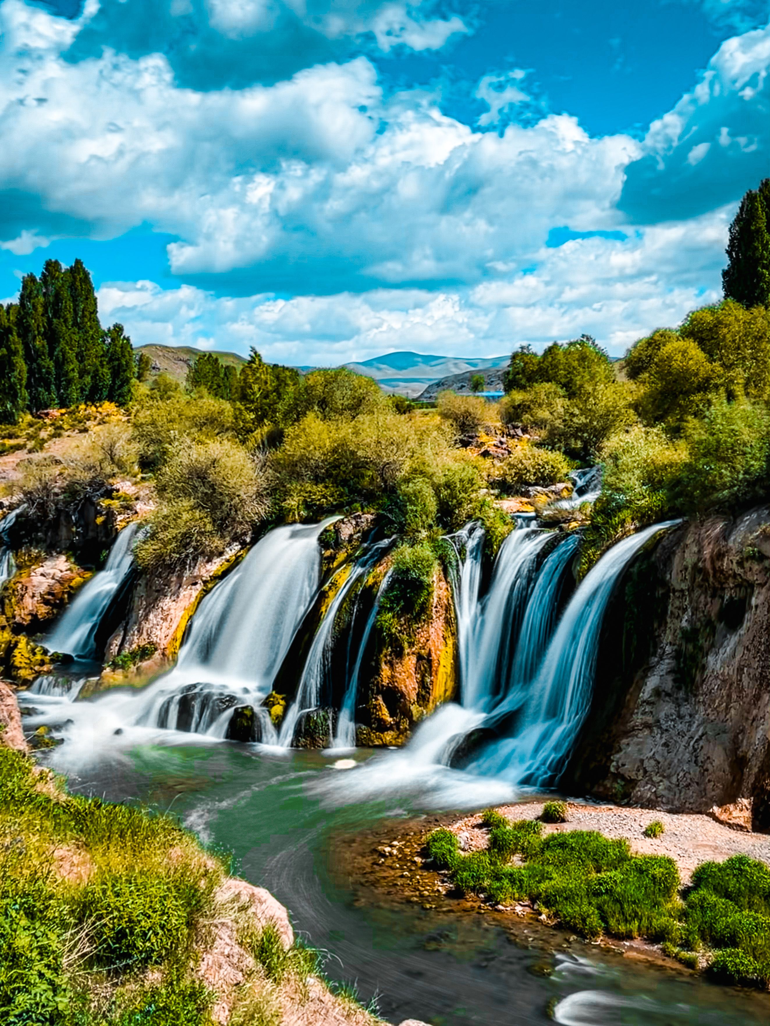 A Beautiful Scenery of Waterfalls and a River · Free Stock Photo