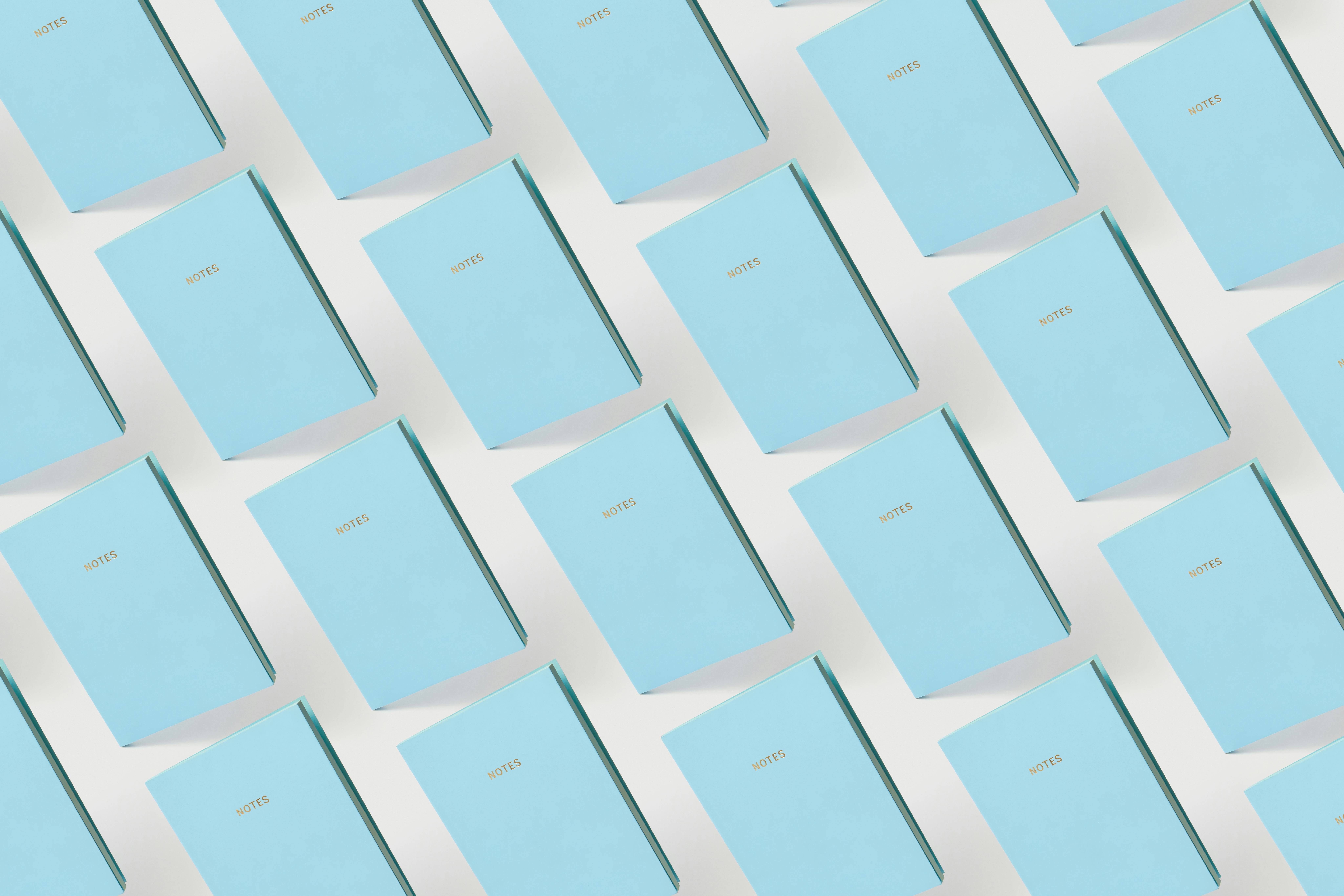 Baby Blue Notebooks on White Surface · Free Stock Photo