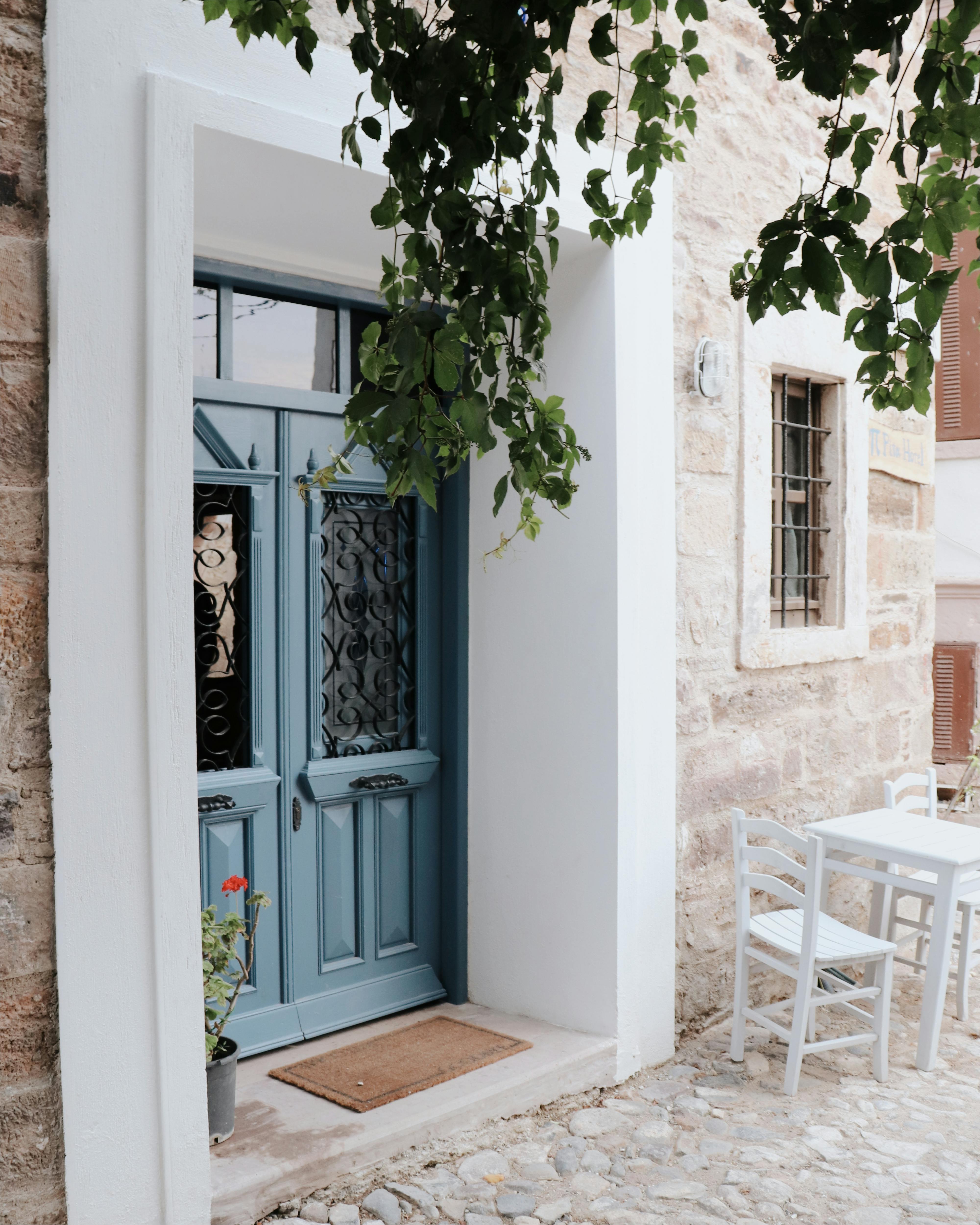 Blue Gate to a Stone House · Free Stock Photo