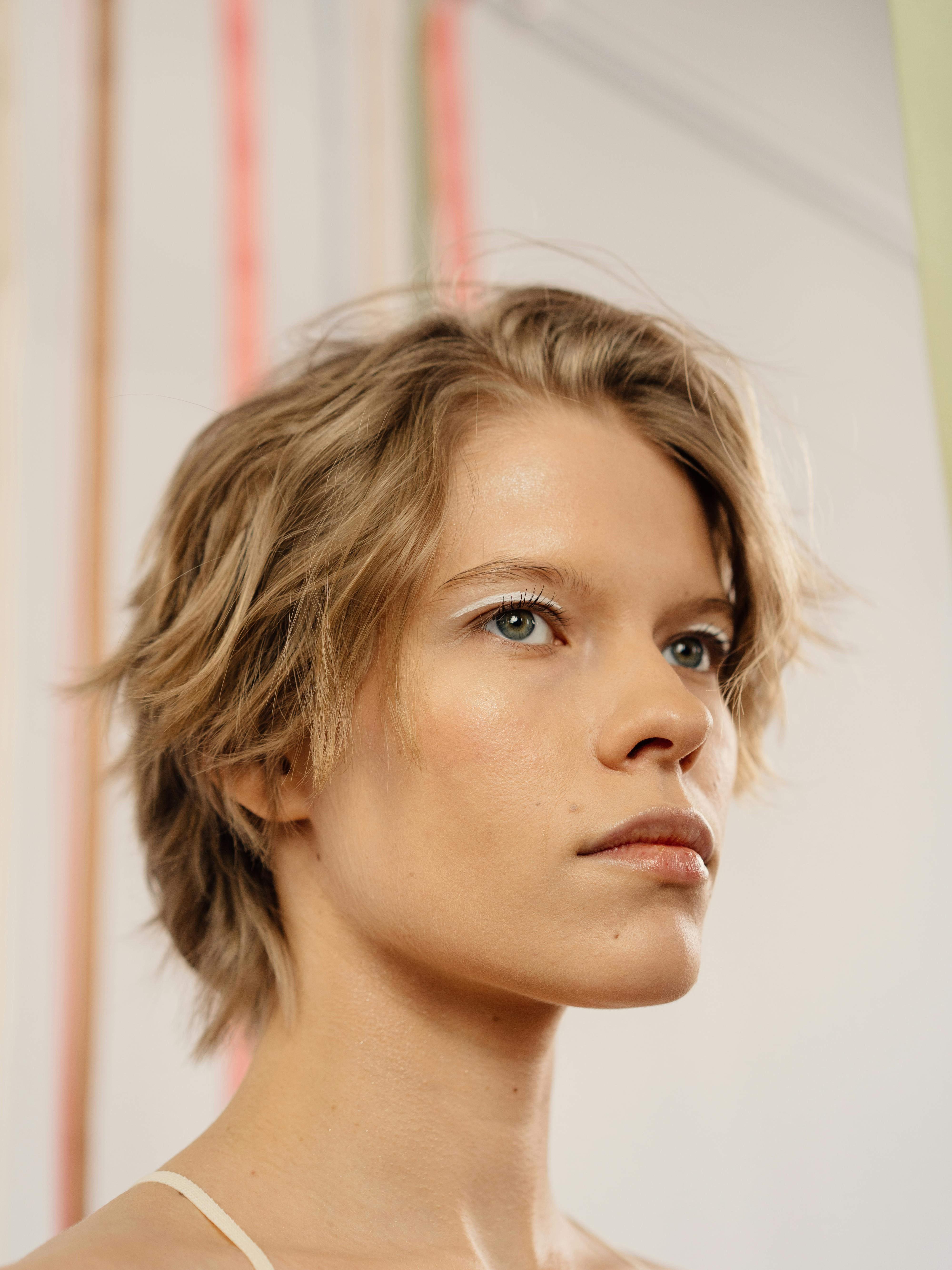 A Low Angle Shot of a Woman with Eye Makeup · Free Stock Photo