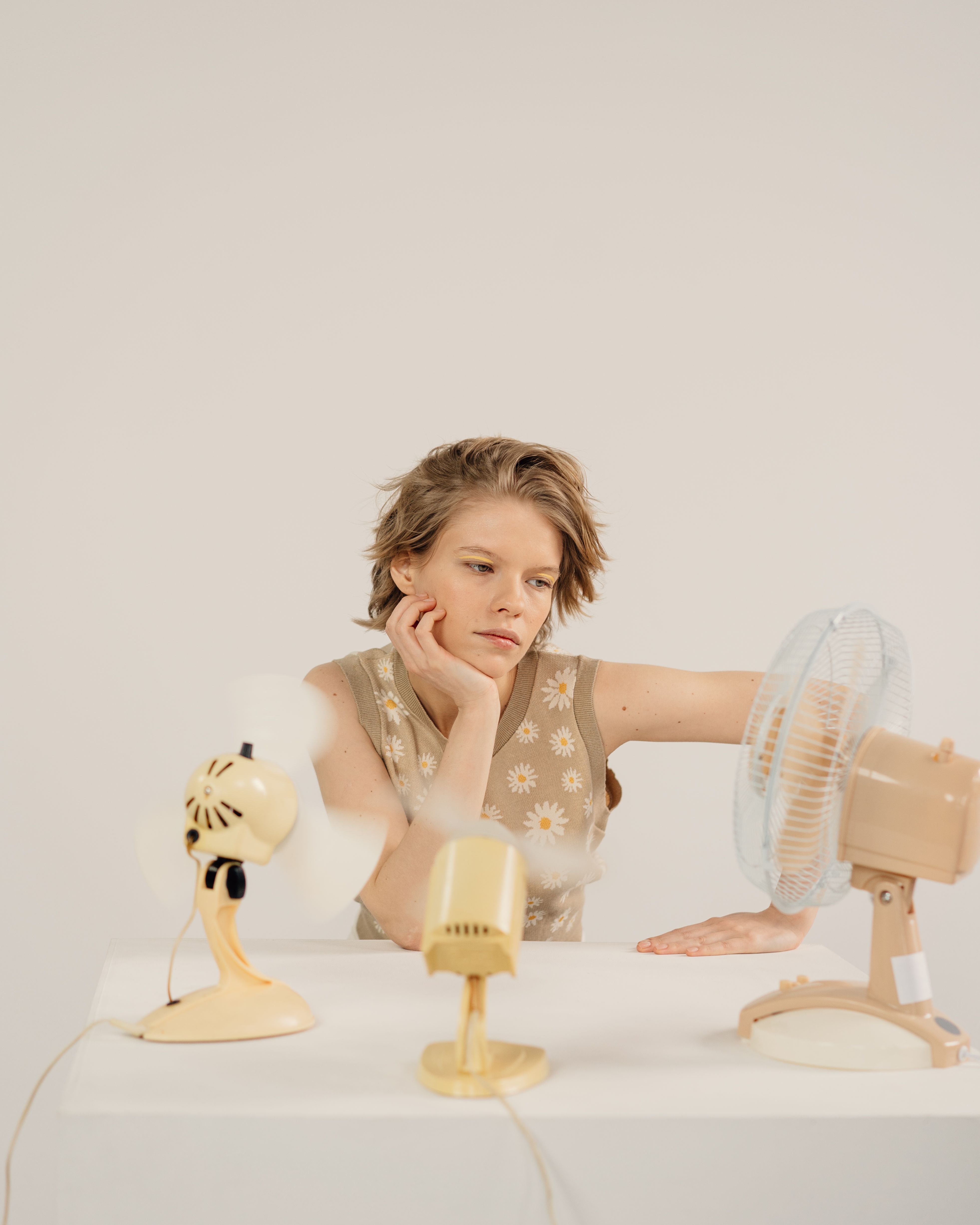 Woman Staring at the Electric Fan · Free Stock Photo