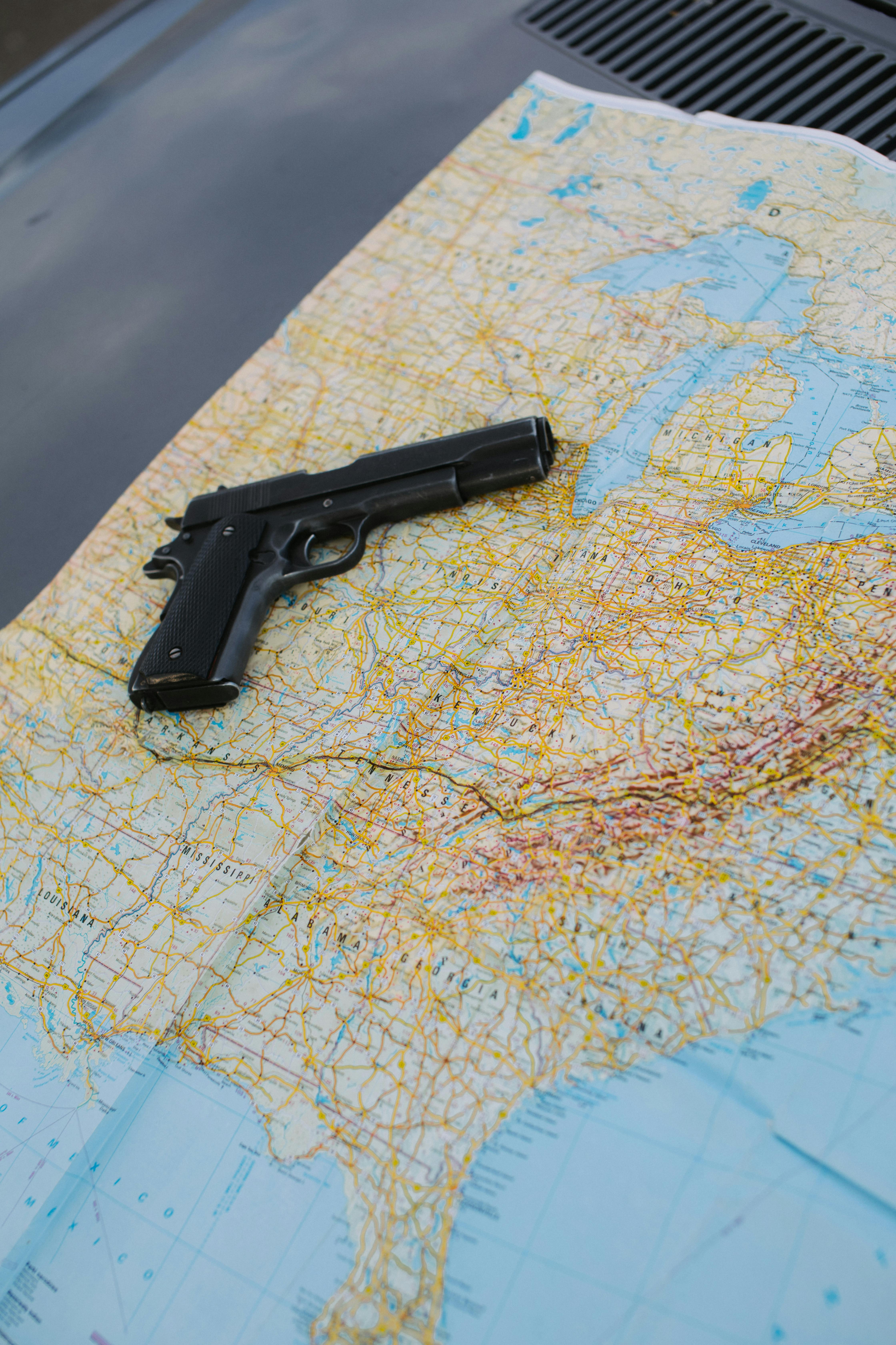 A Gun on a Map · Free Stock Photo