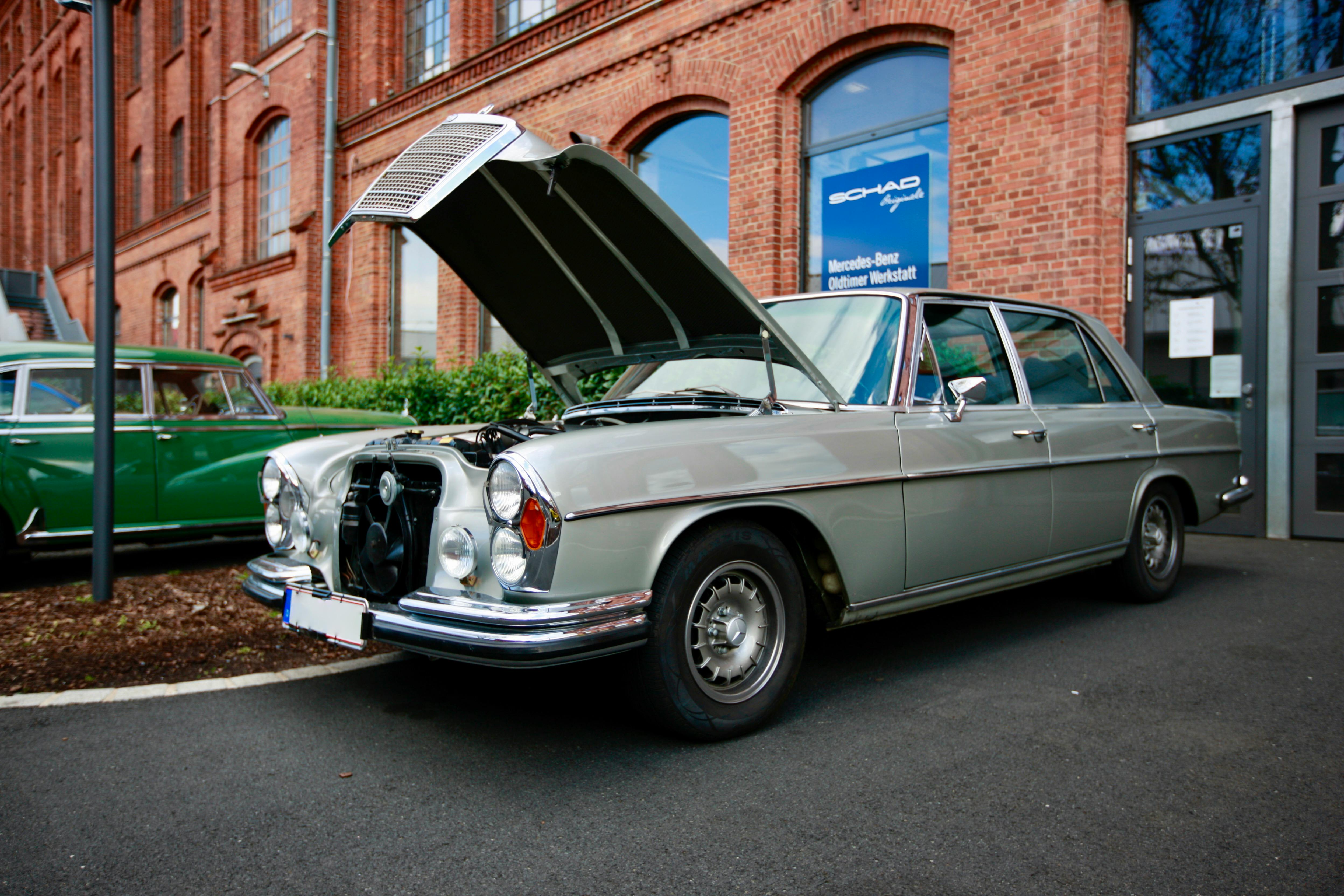 A Vintage Car with an Opened Car Hood · Free Stock Photo