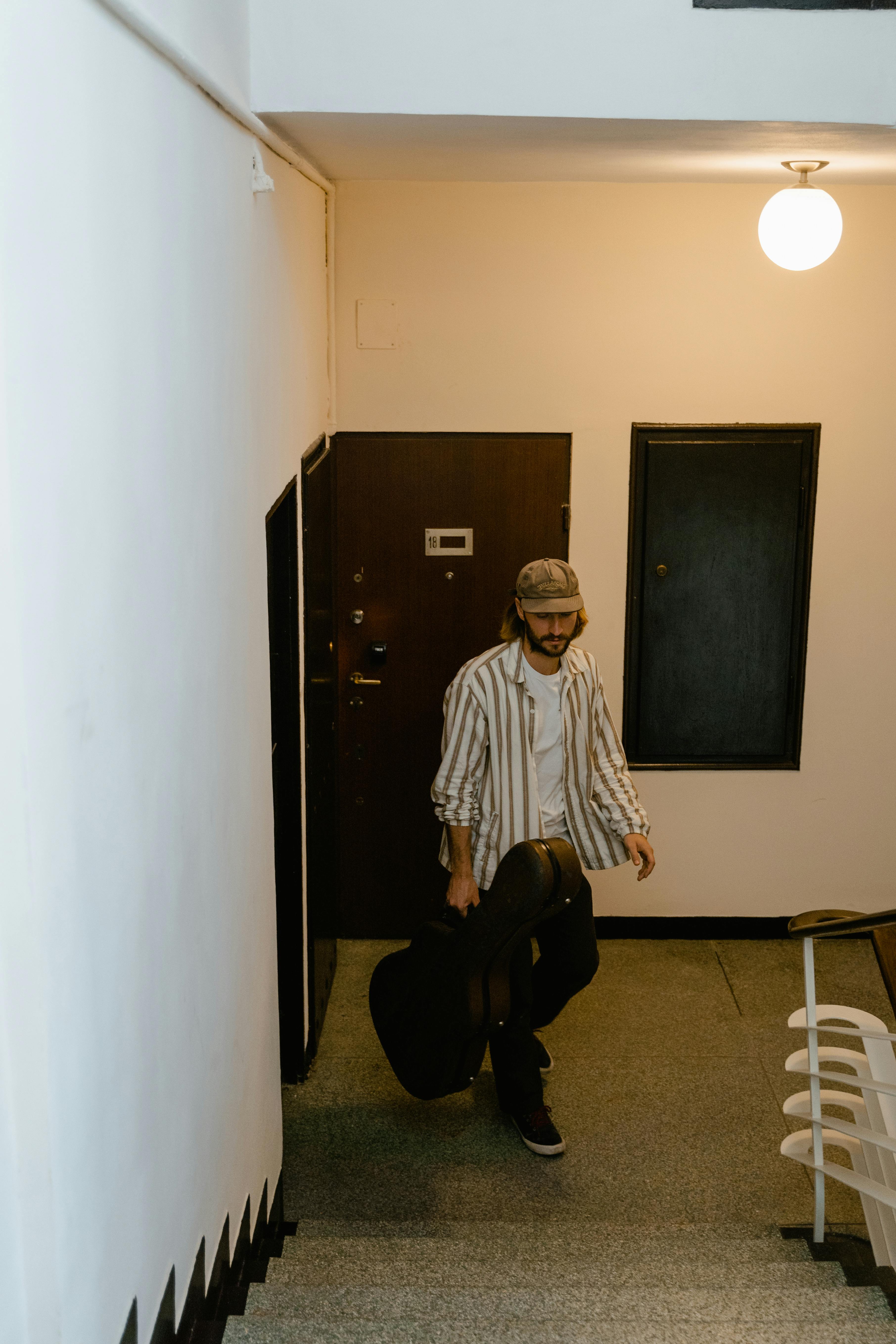 Man Carrying His Guitar · Free Stock Photo