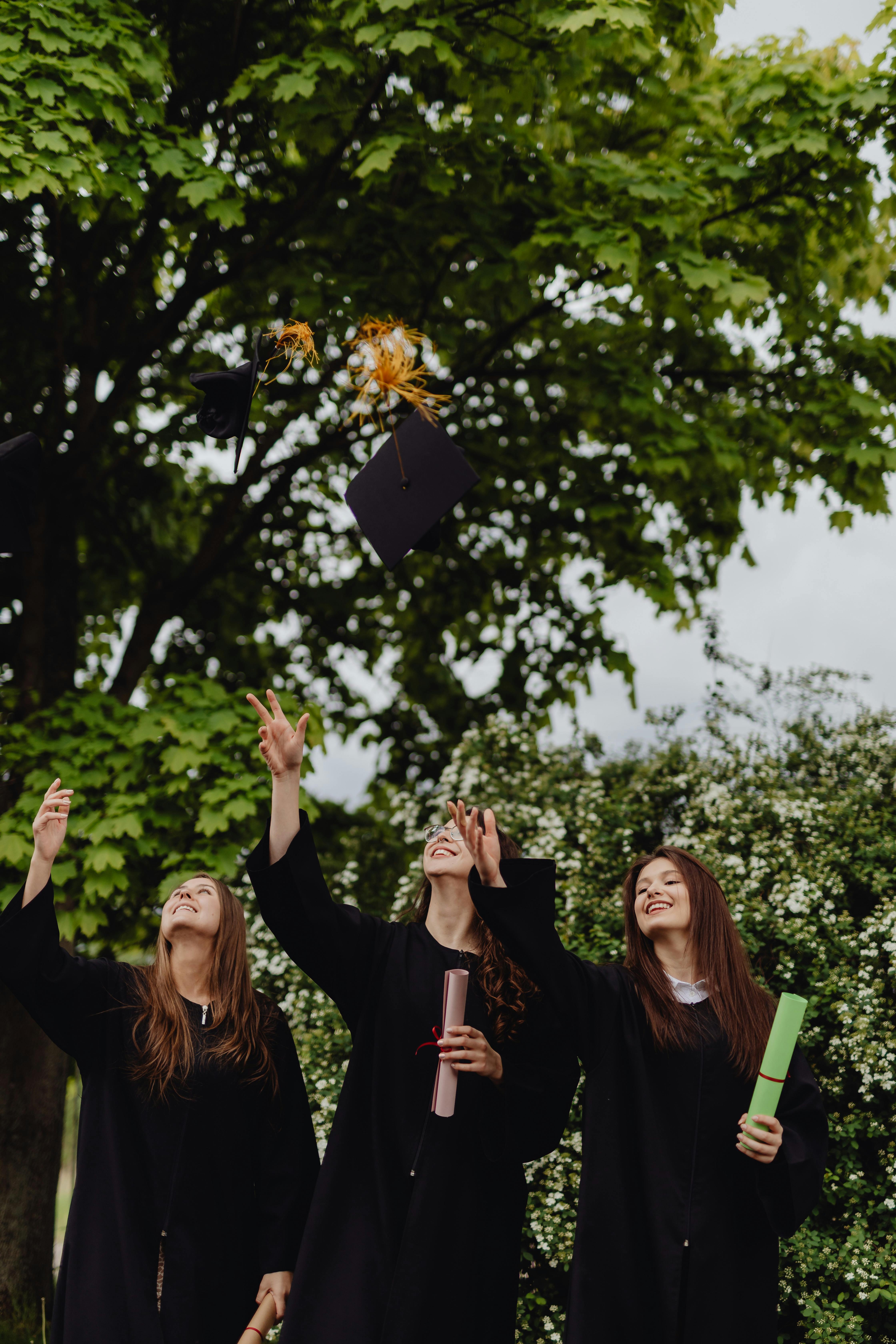 Women Throwing Graduation Hats · Free Stock Photo
