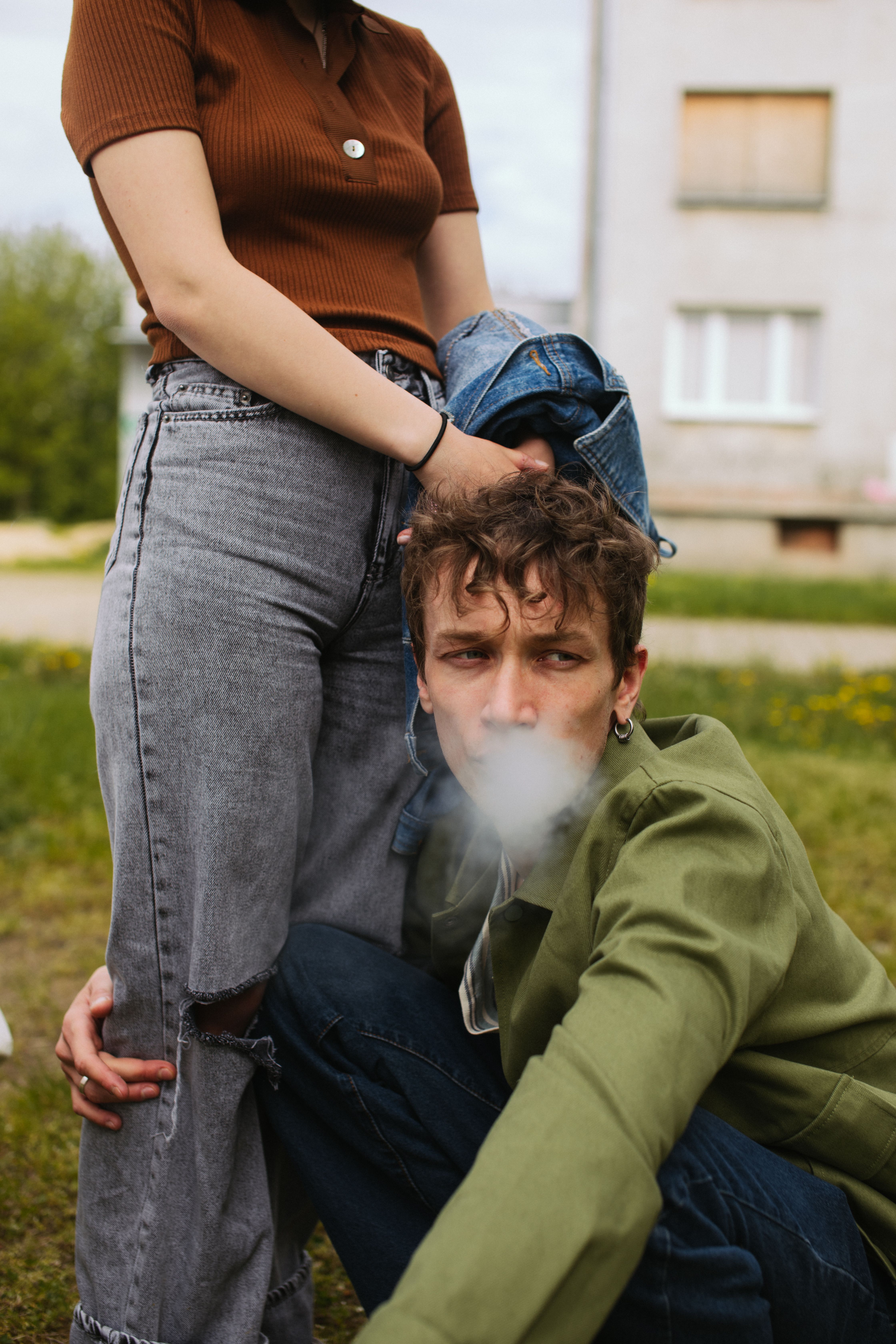 Man in Green Shirt and Blue Denim Jeans smoking Cigarettes · Free Stock ...
