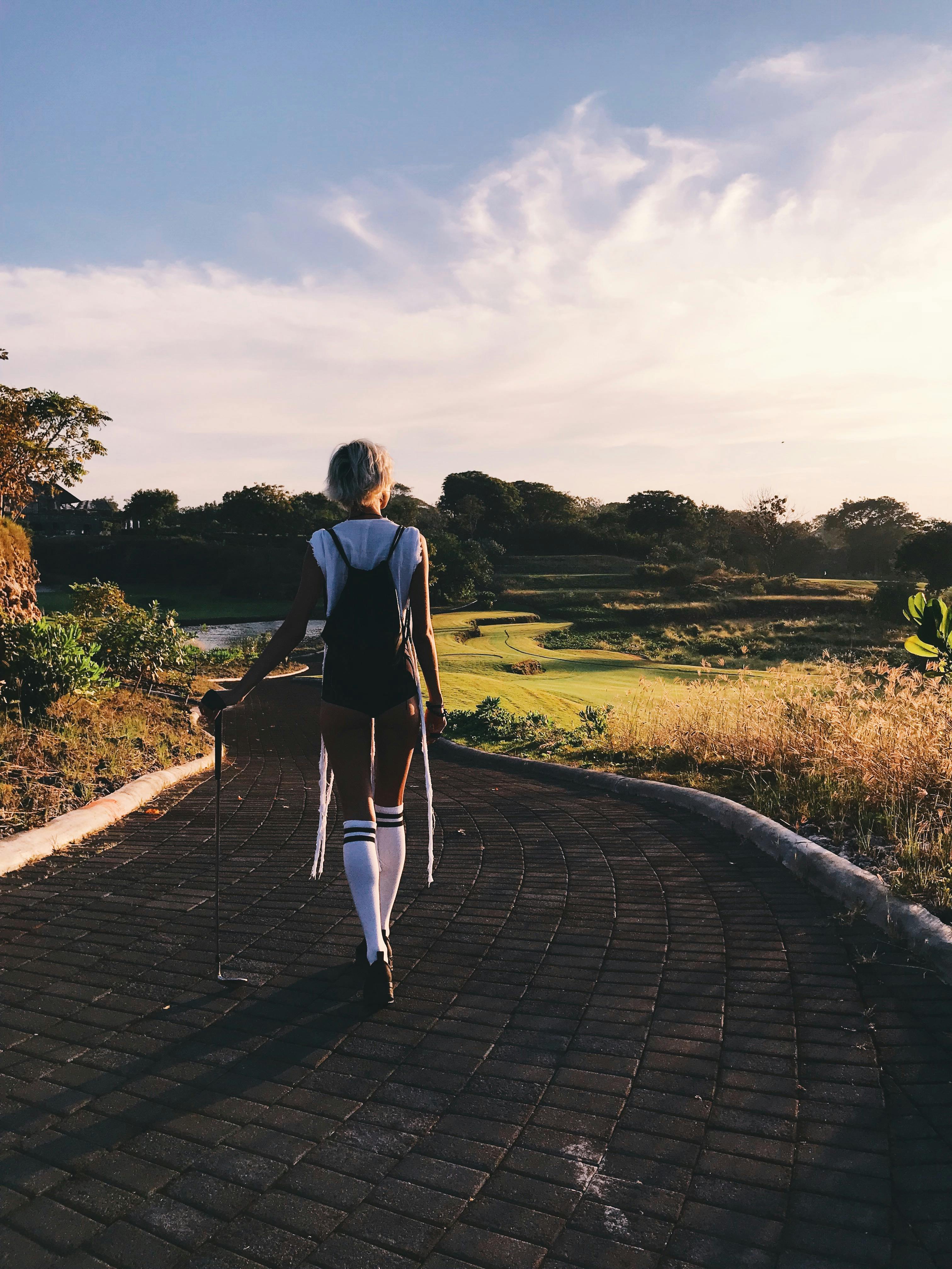 Back View of a Woman Wearing Knee Socks · Free Stock Photo