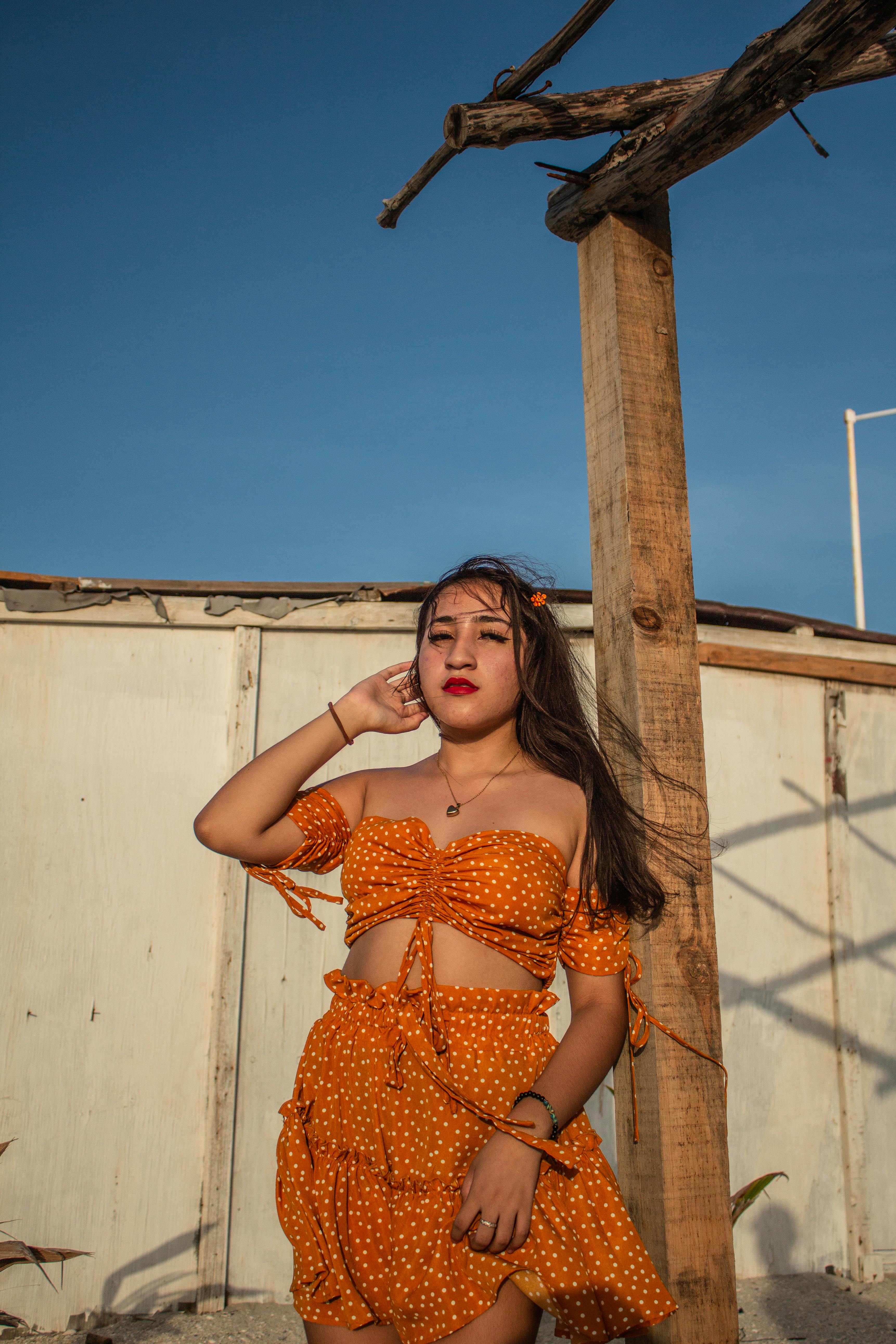 Woman in Exotic Clothes Posing Outdoors · Free Stock Photo