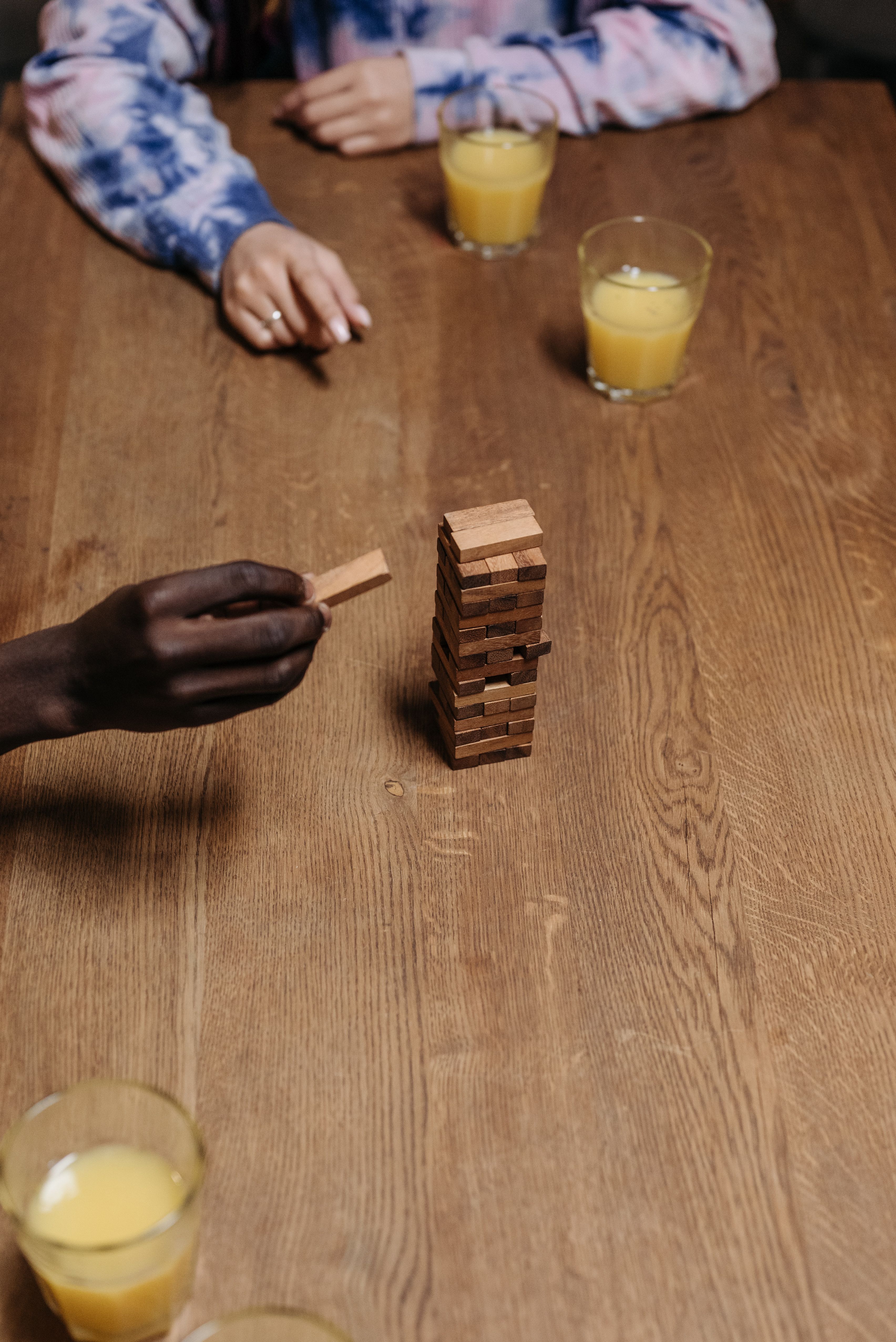 Person Holding a Brown Wooden Block · Free Stock Photo