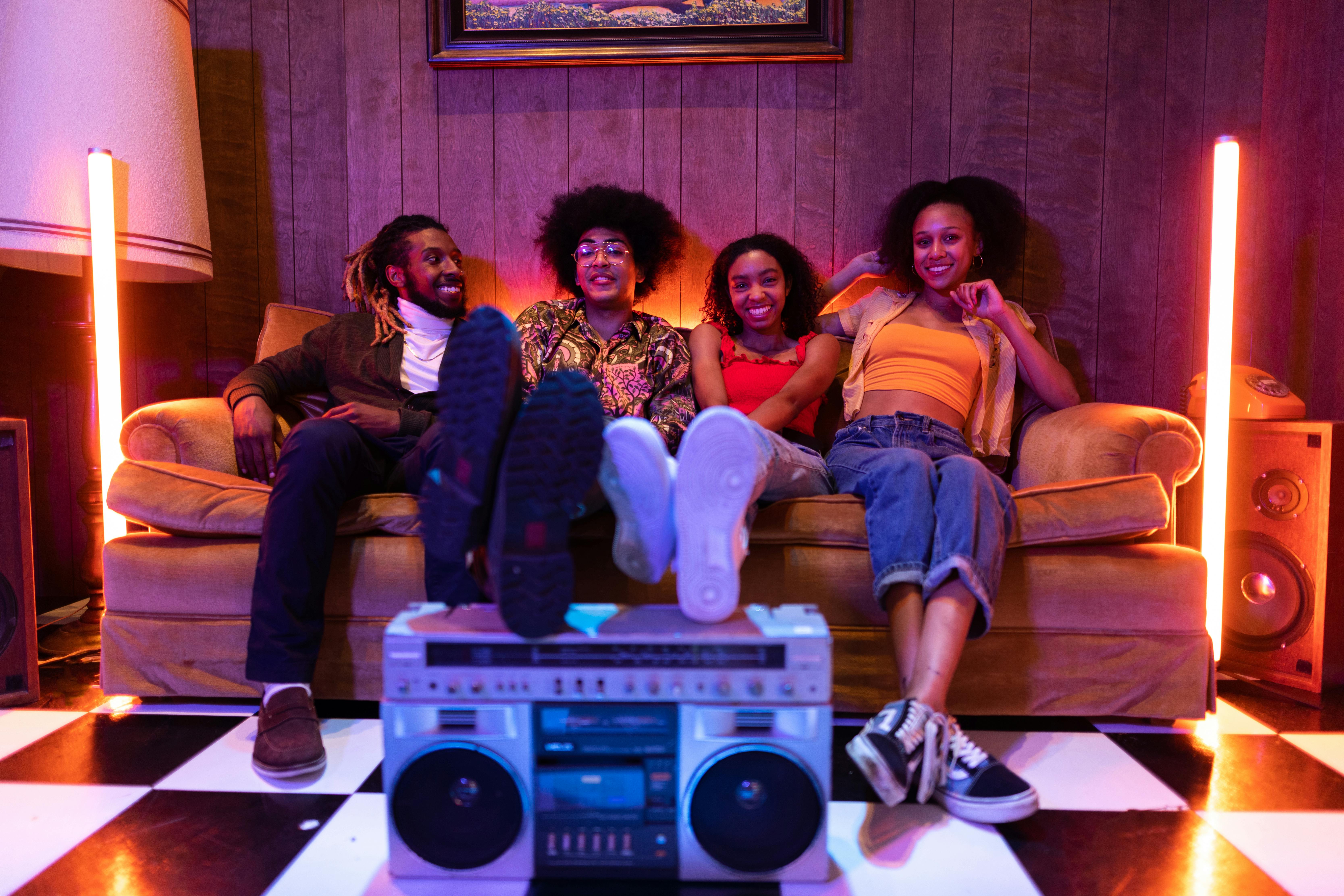 People Sitting on Brown Sofa · Free Stock Photo