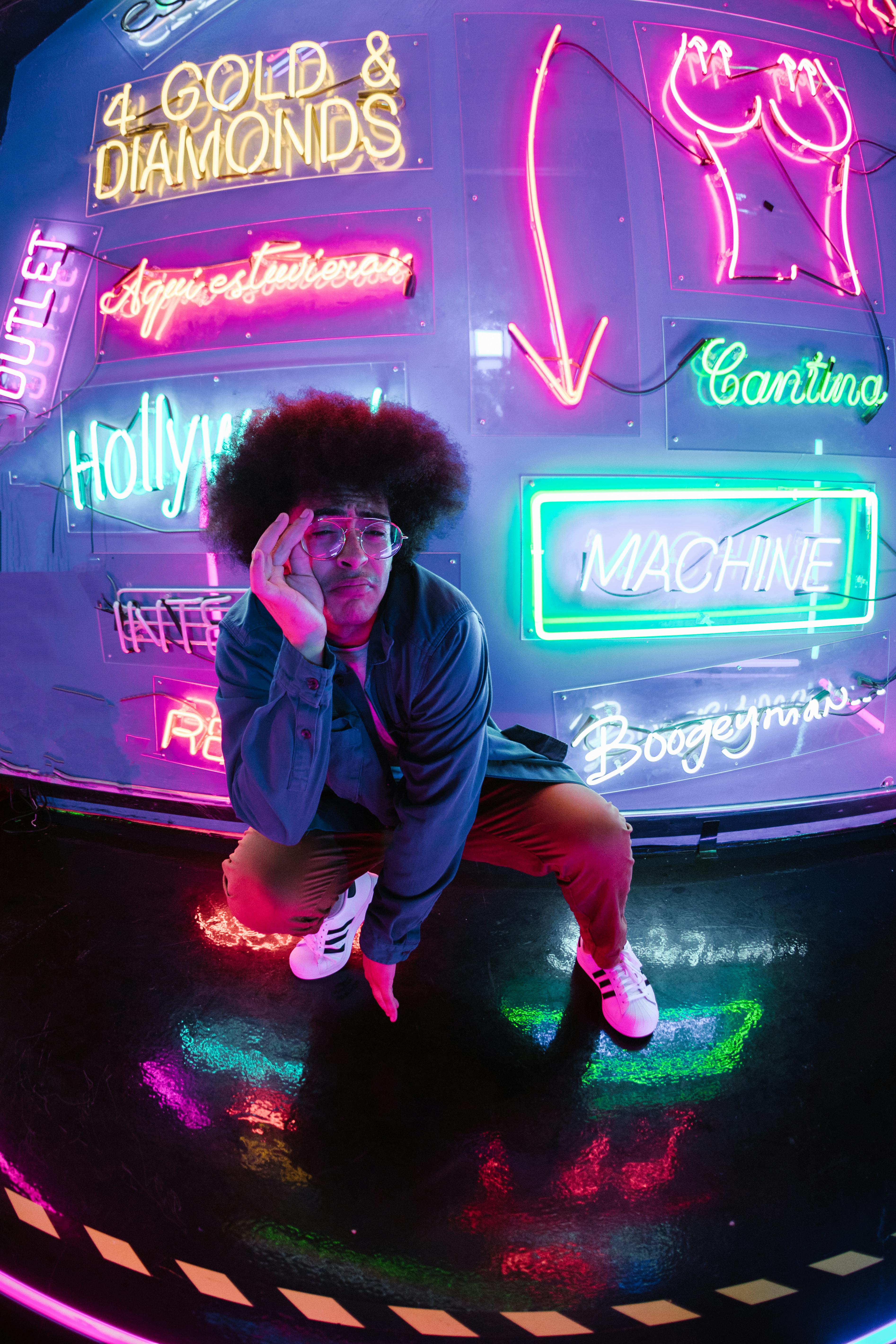 Man Posing in Front of Neon Lights · Free Stock Photo