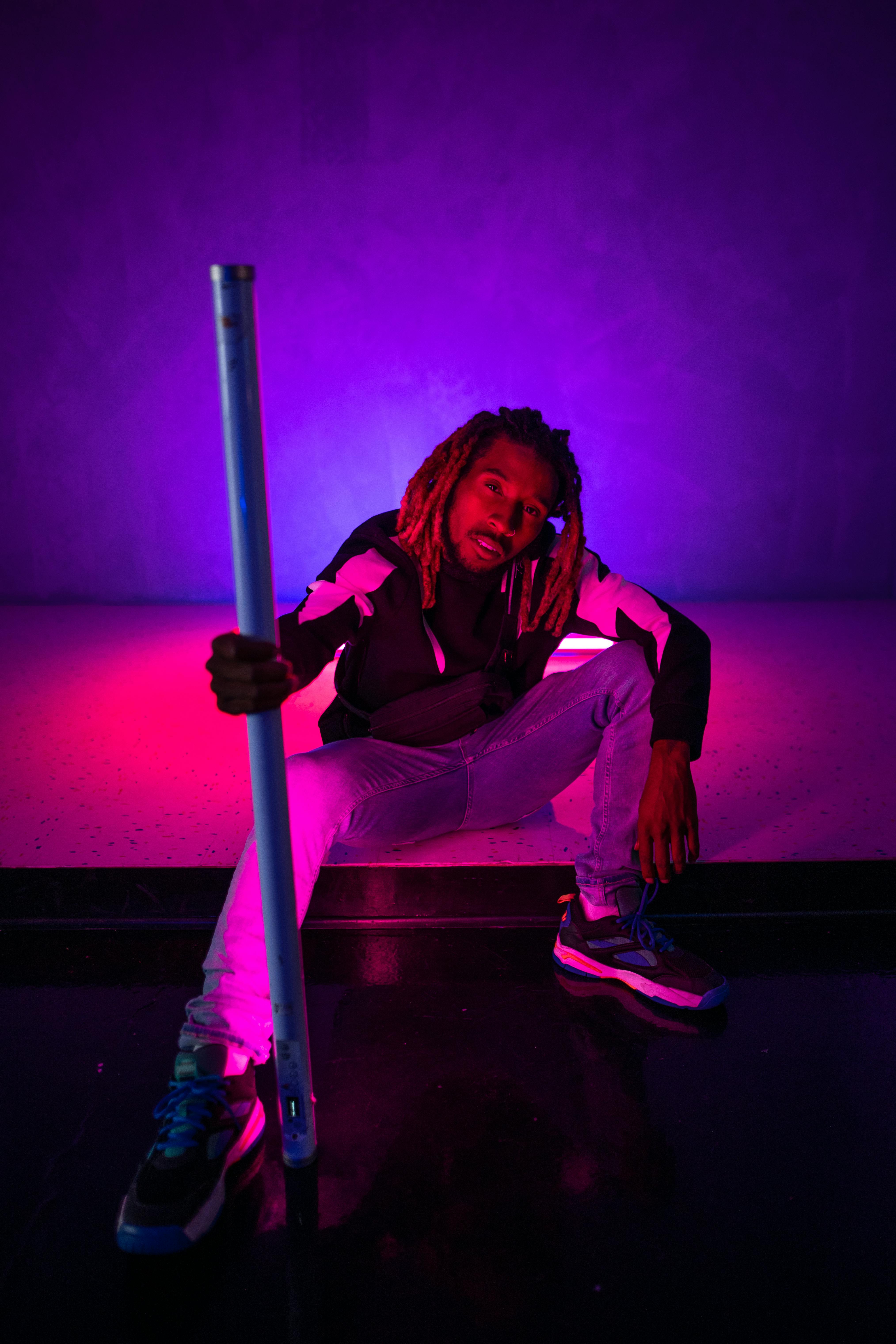 A Man Holding a Metal Rod · Free Stock Photo