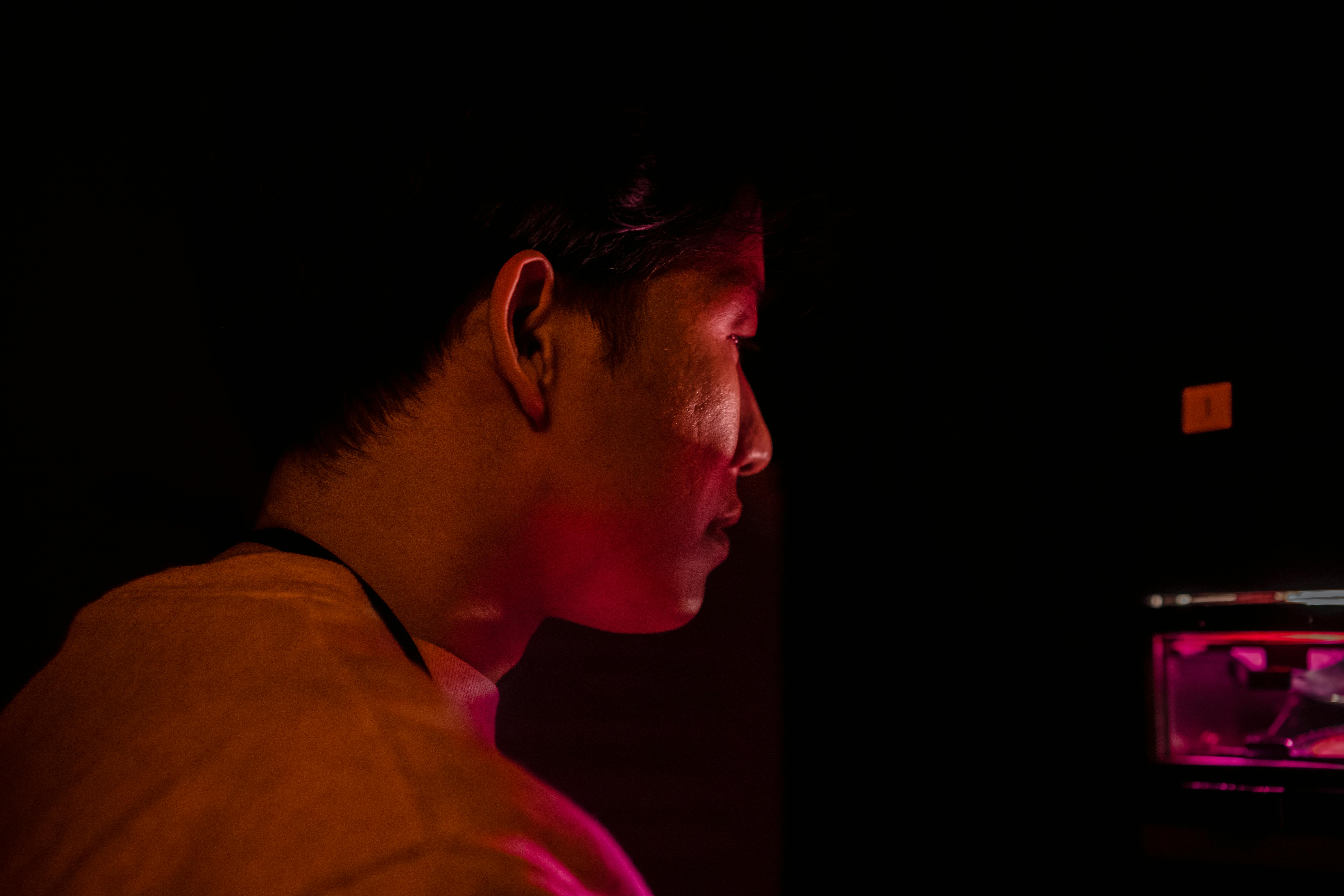 Man in Darkness near Pink Light · Free Stock Photo