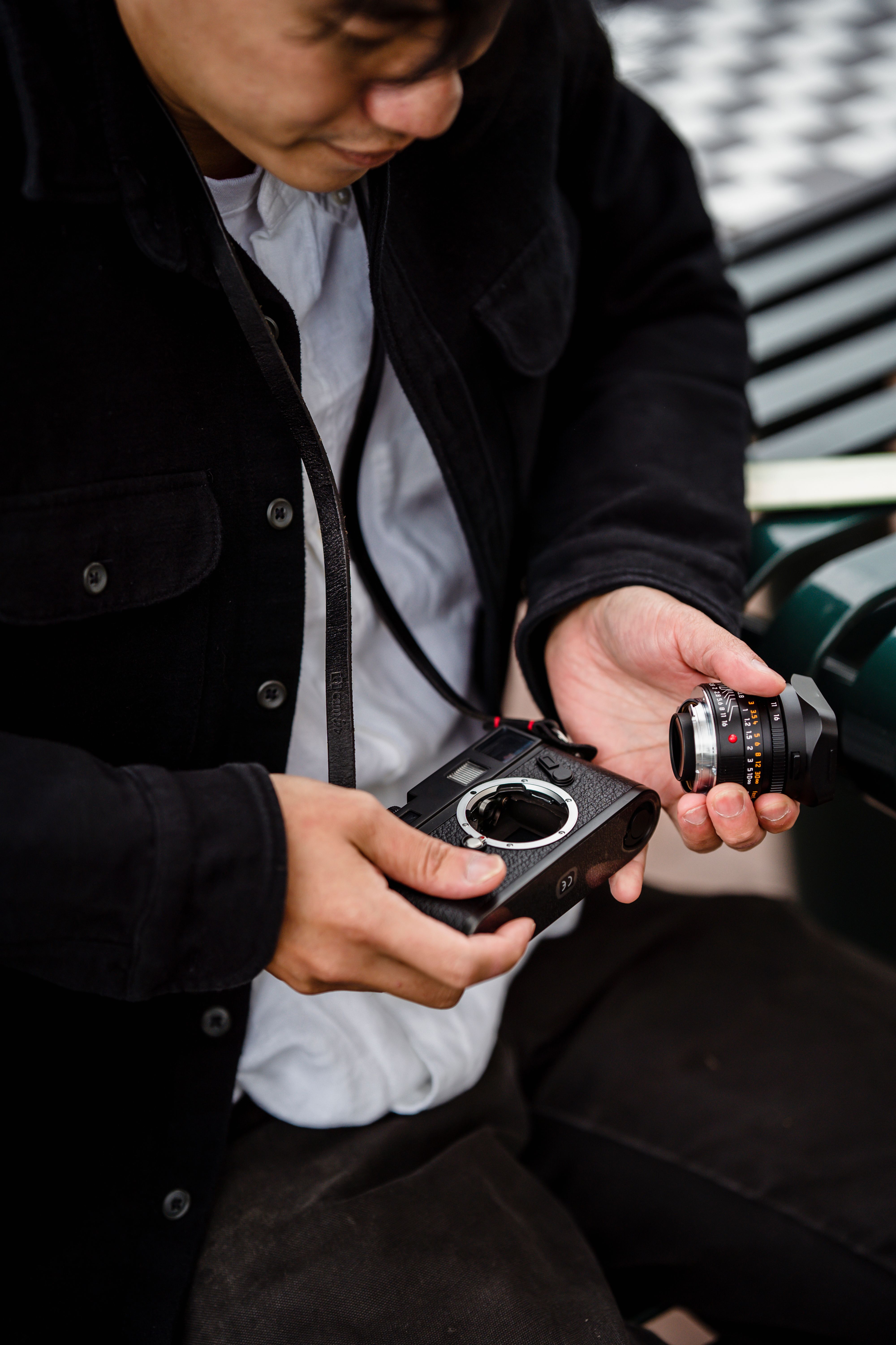 Man Changing the Camera Lens · Free Stock Photo