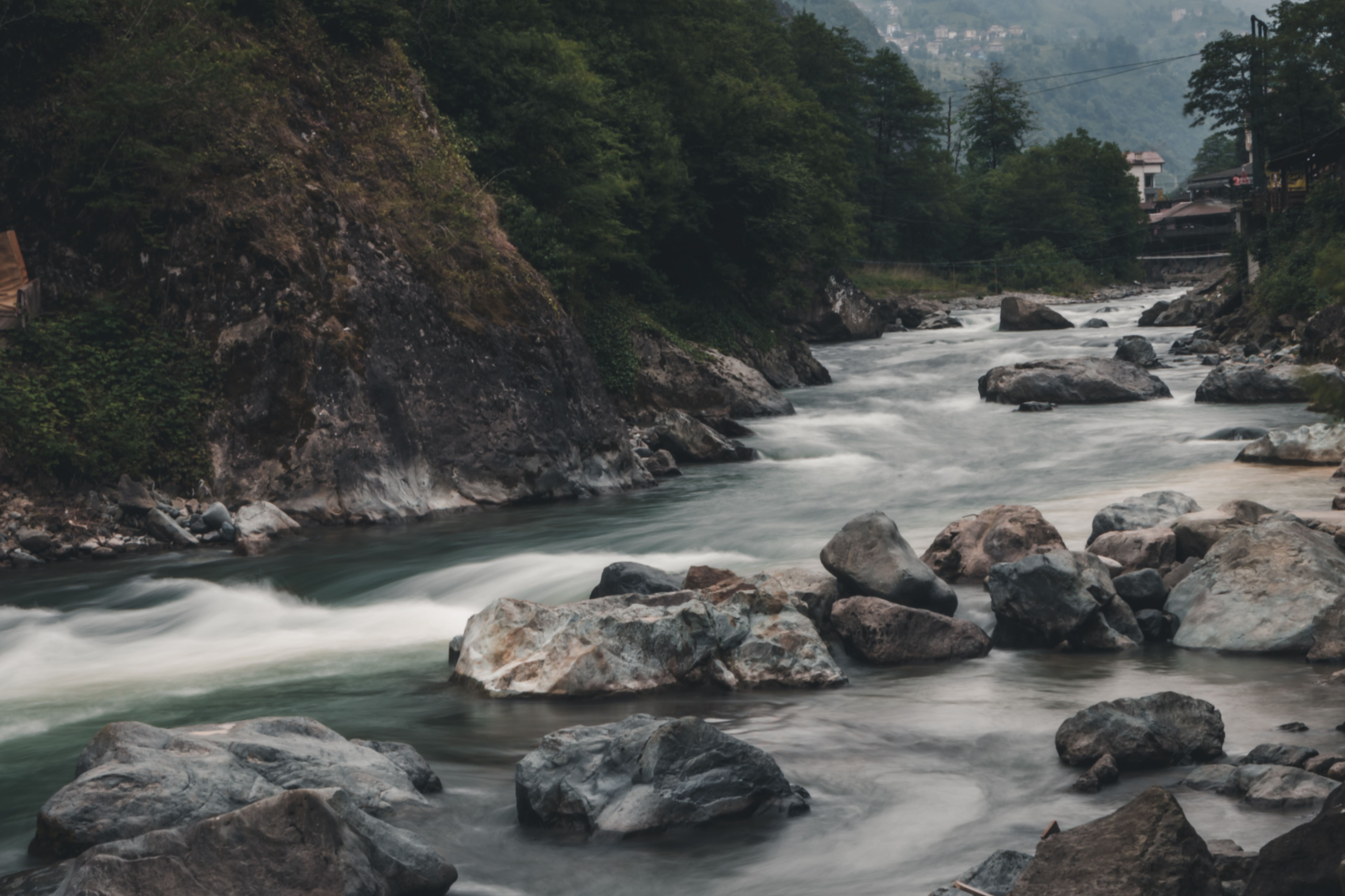 A Running River with Rocks · Free Stock Photo