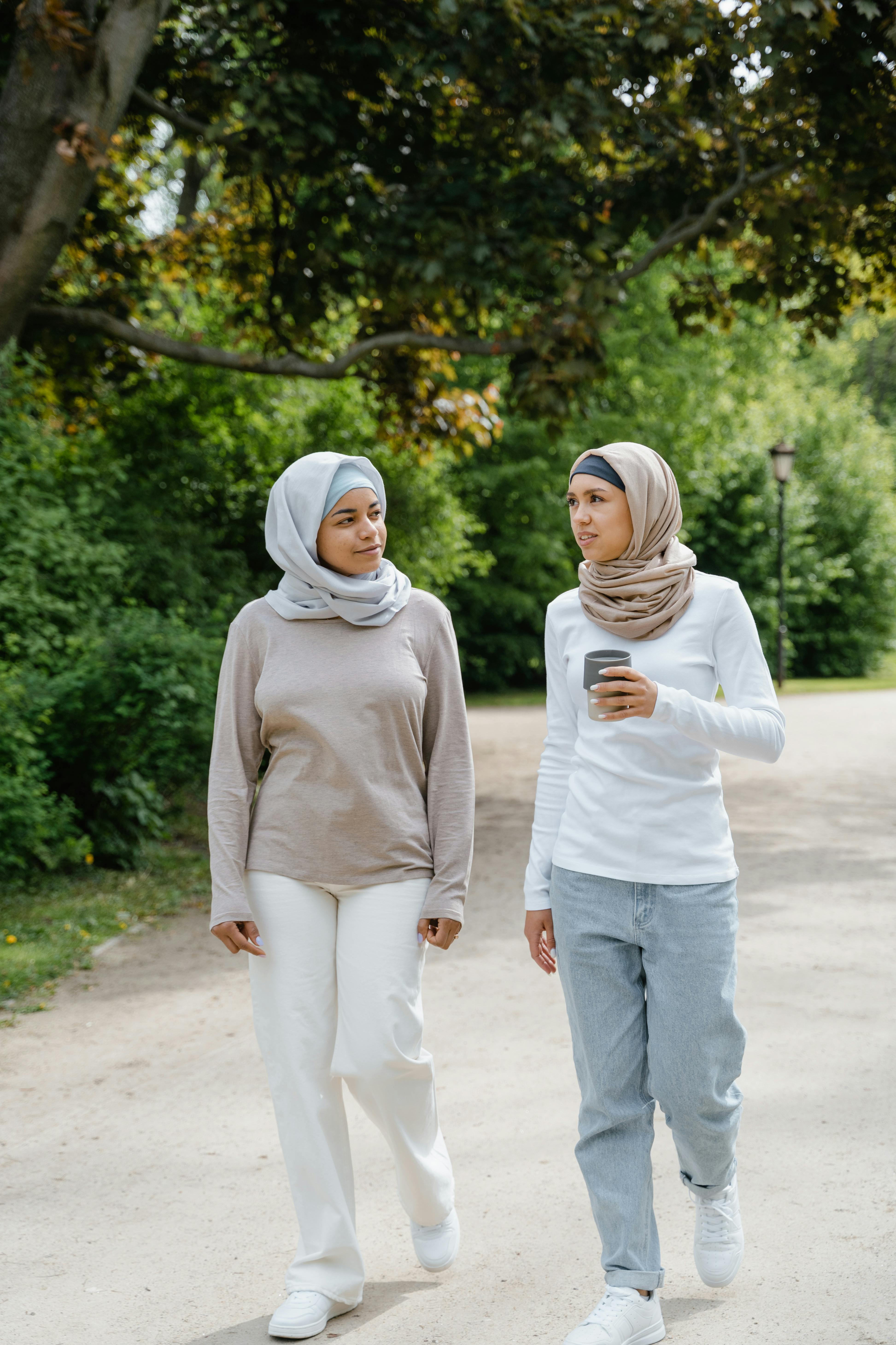 Women Walking on Pathway · Free Stock Photo