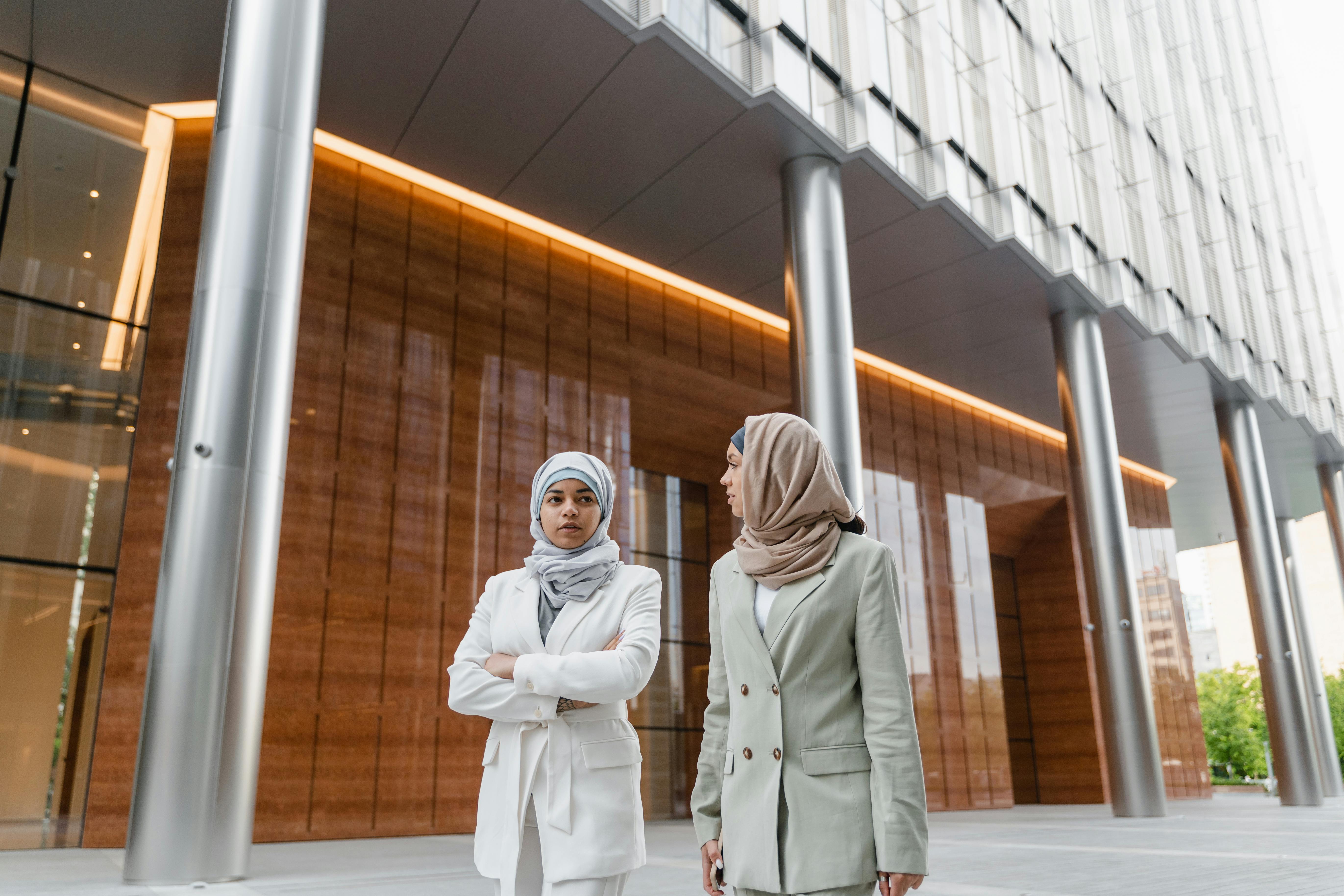 Women in Corporate Attire Wearing Hijabs Walking Outside a Building ...
