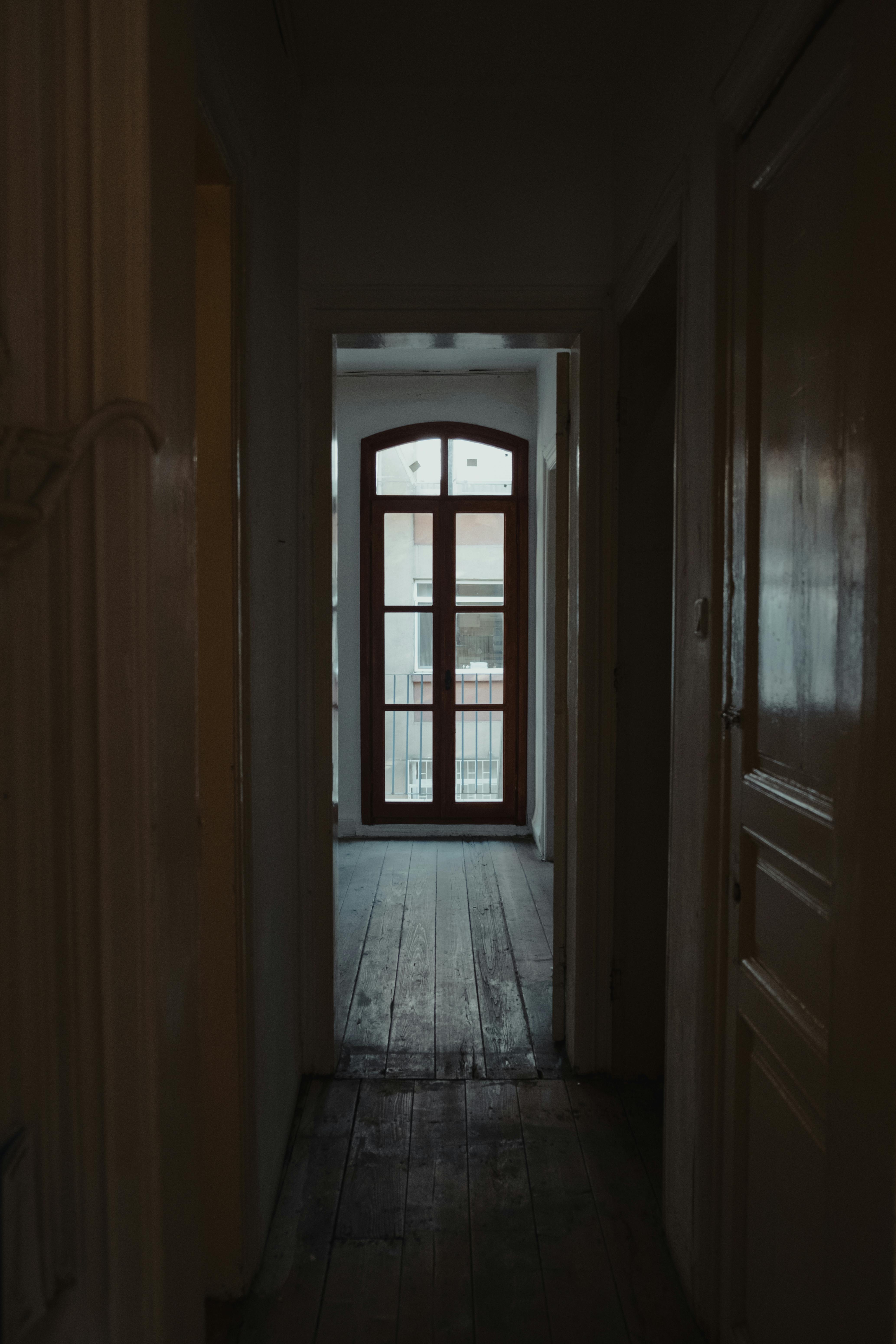 Symmetrical View of a Corridor in an Apartment and Balcony Door · Free ...