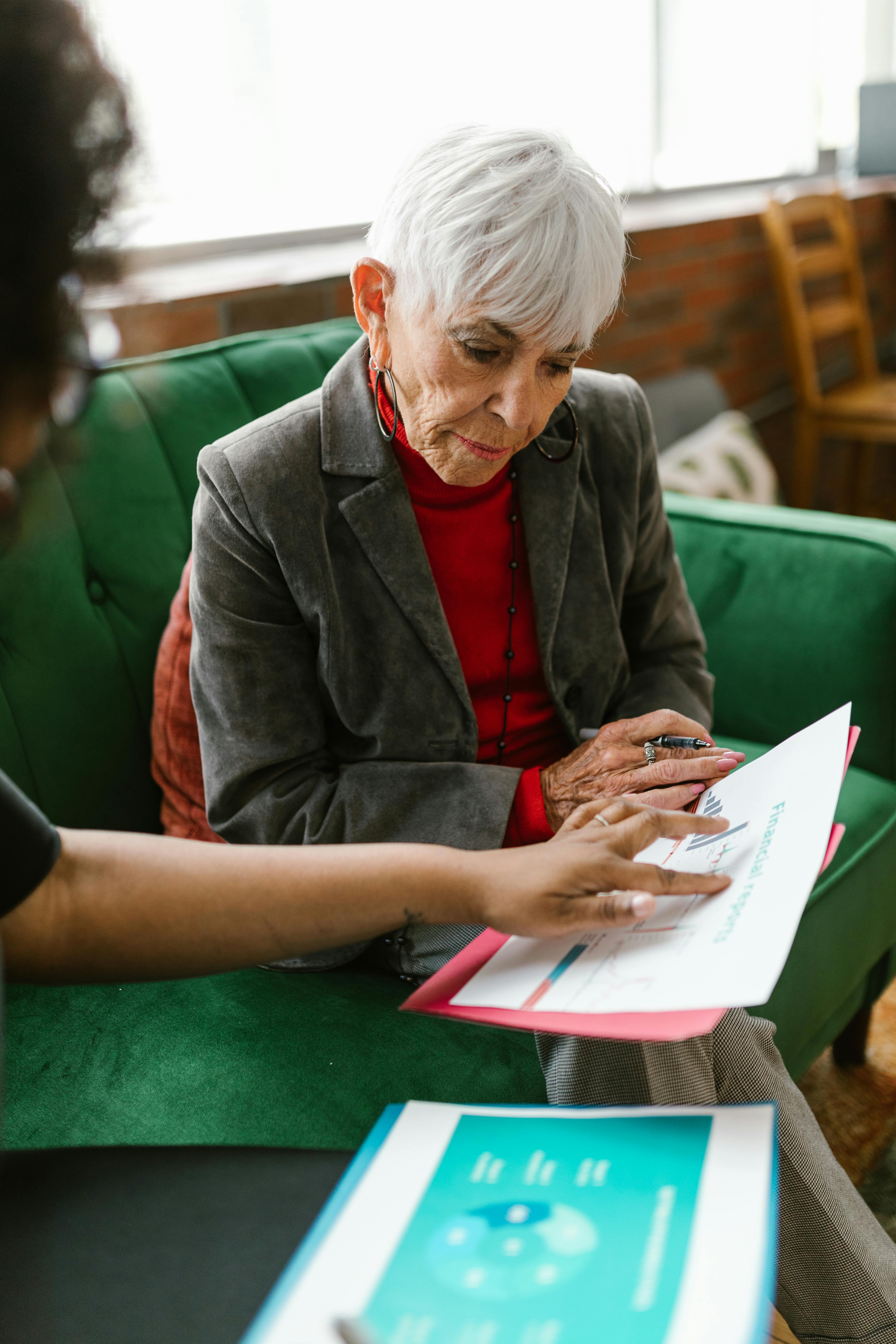 People in the Meeting Looking at the Papers · Free Stock Photo
