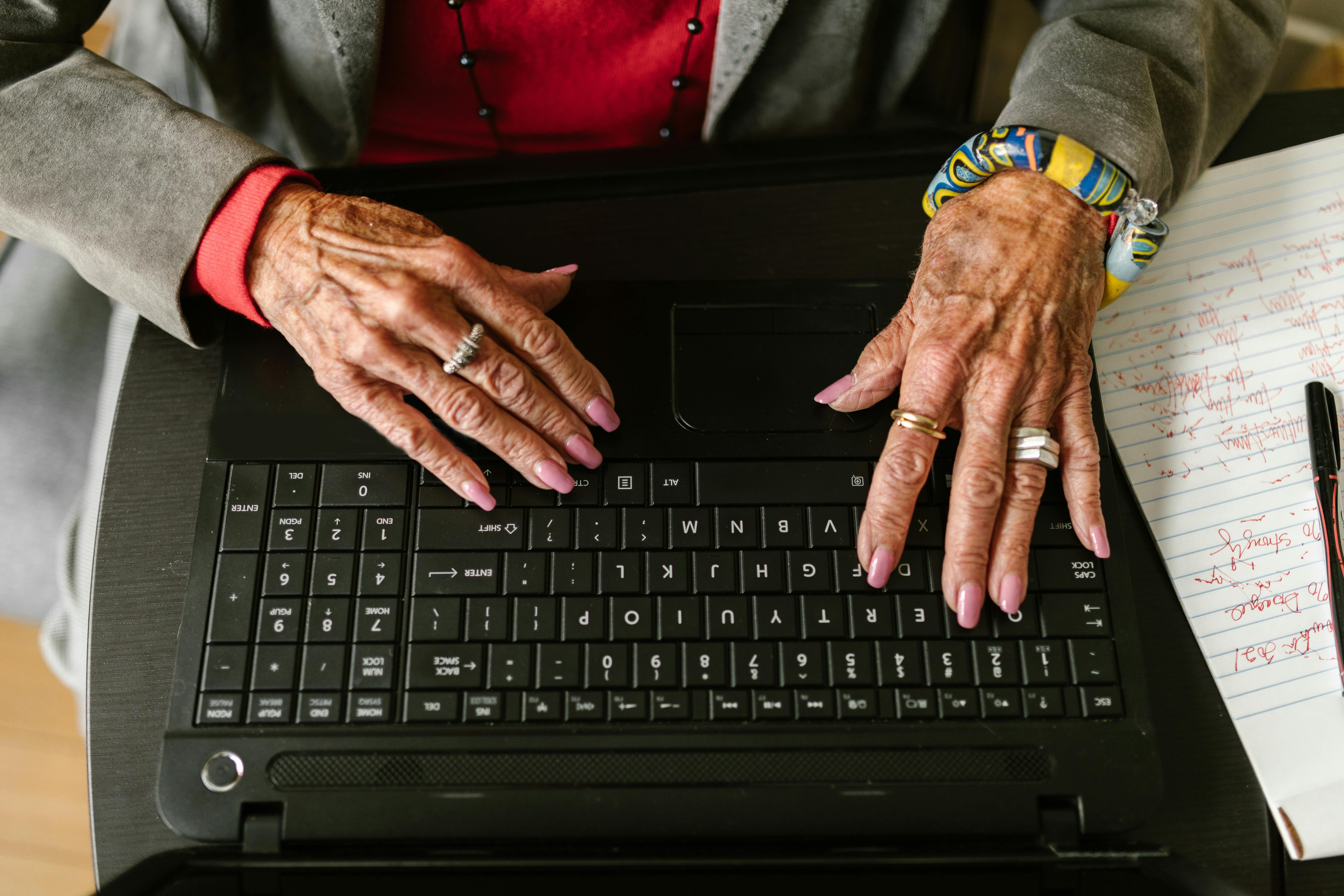 A Person Typing on Laptop · Free Stock Photo