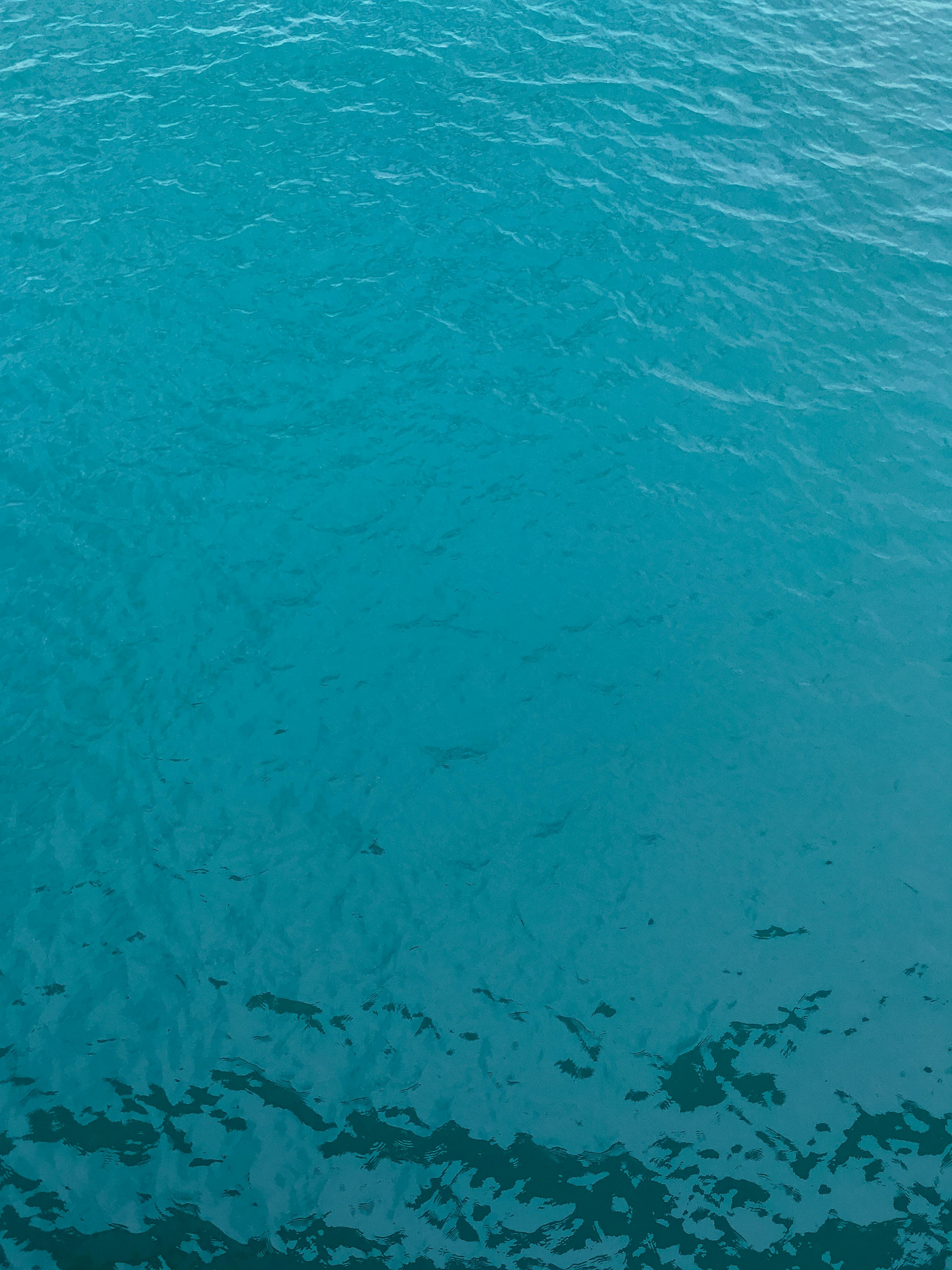 Building at Edge of Jetty Extending into Sea · Free Stock Photo