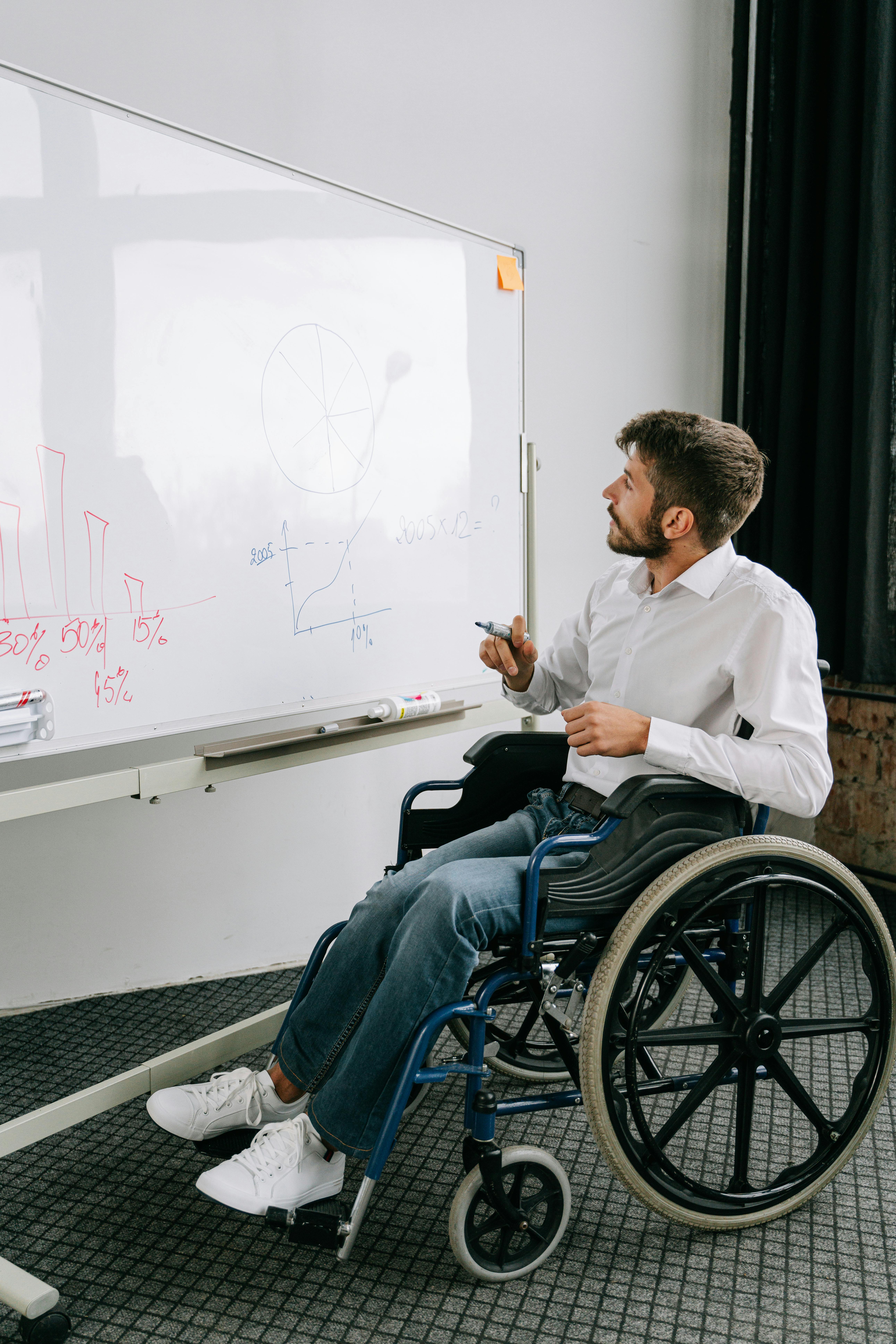 A Man Looking at a Whiteboard · Free Stock Photo
