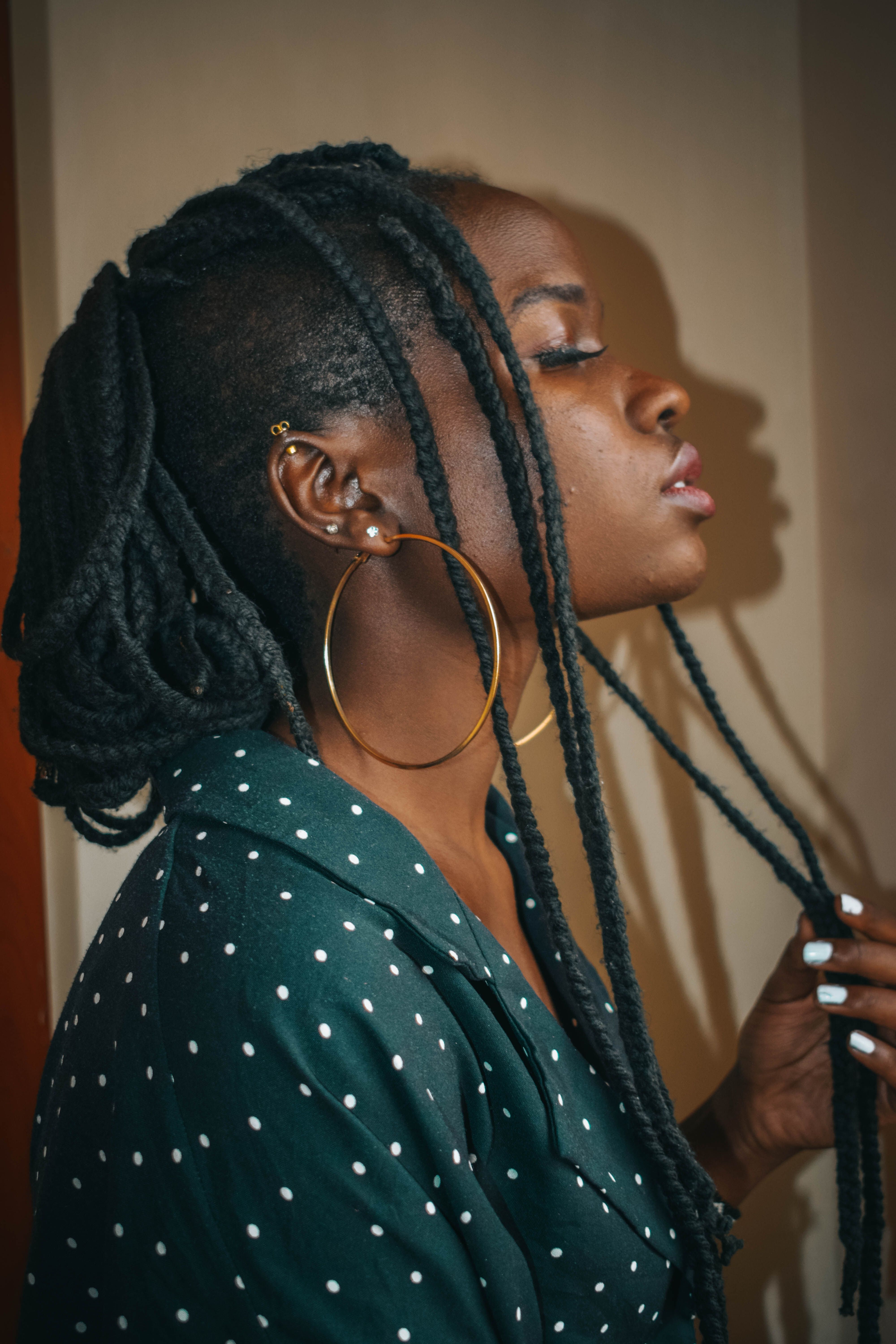 Side View of a Woman with Braided Hairstyle · Free Stock Photo