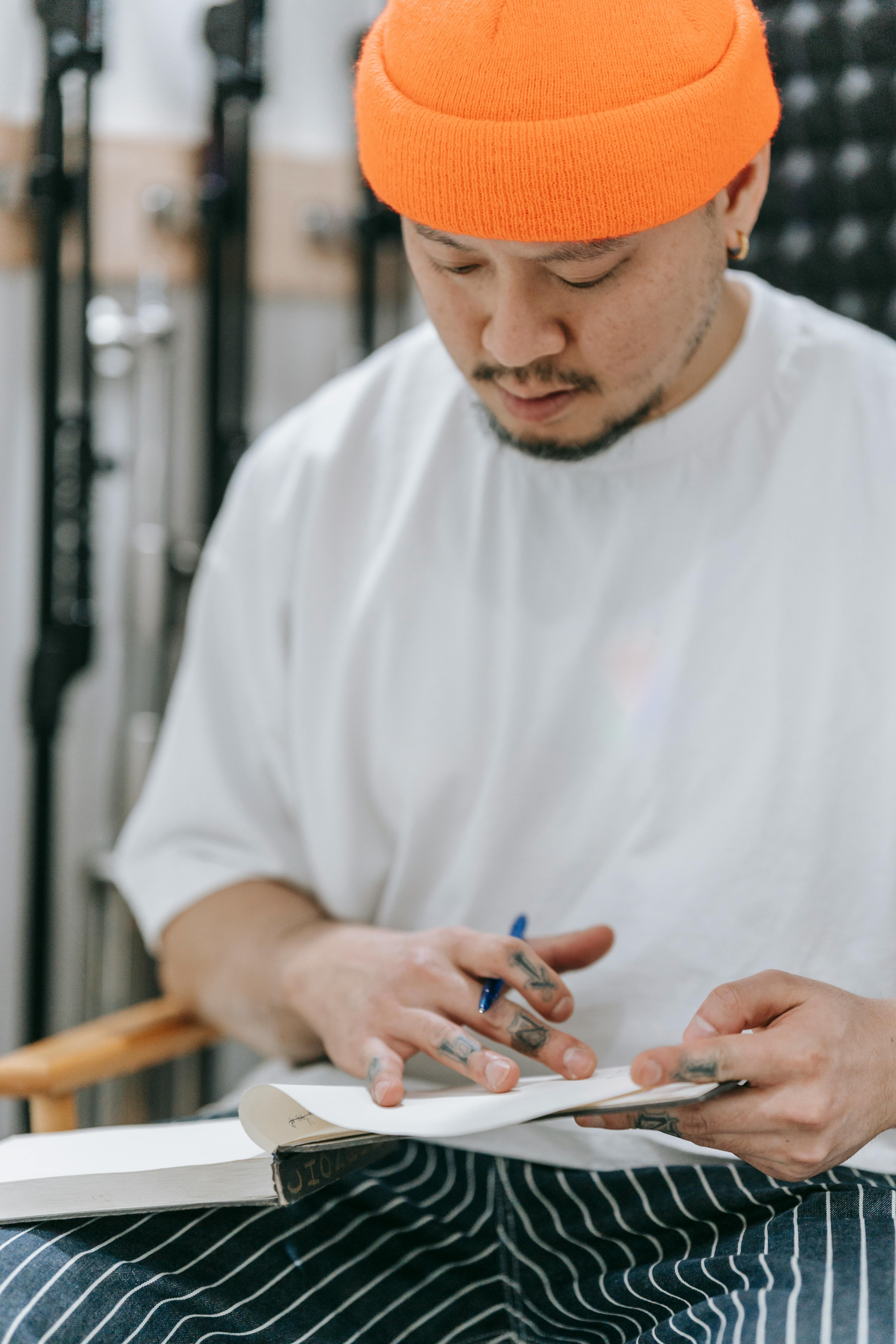 Man with Pen and Notebook · Free Stock Photo