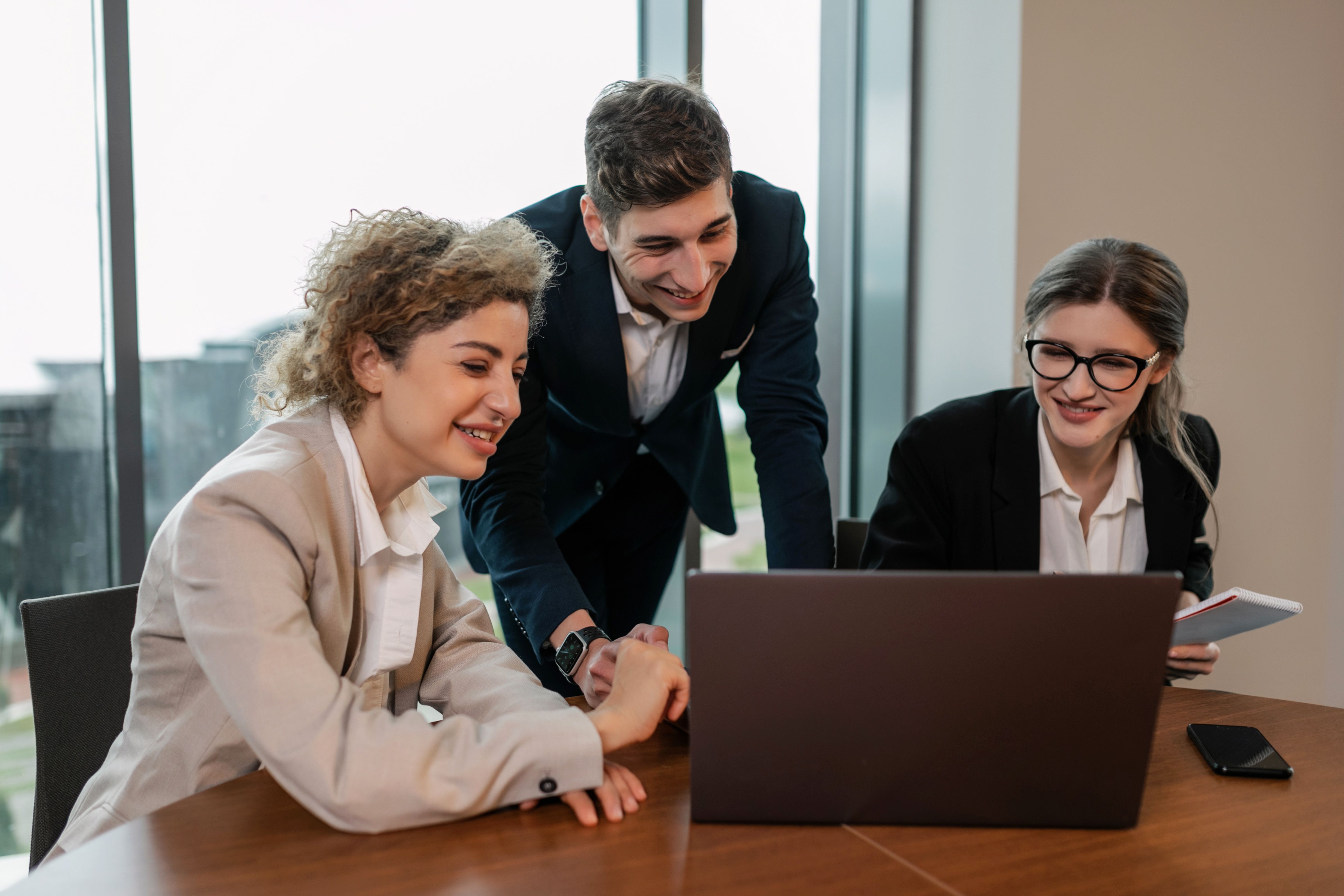 A People Looking the Laptop Together · Free Stock Photo