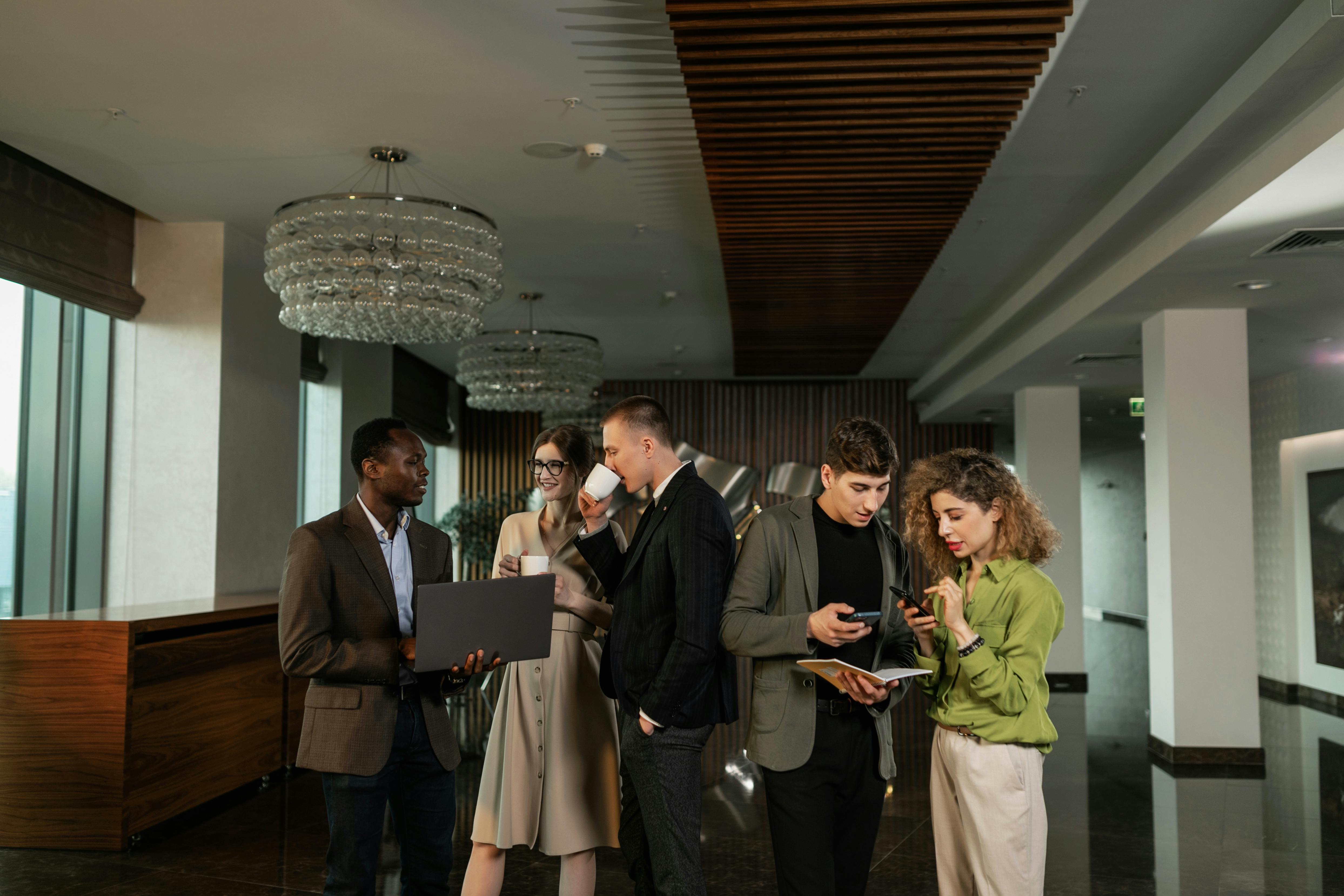 Group of People Standing on Hallway · Free Stock Photo