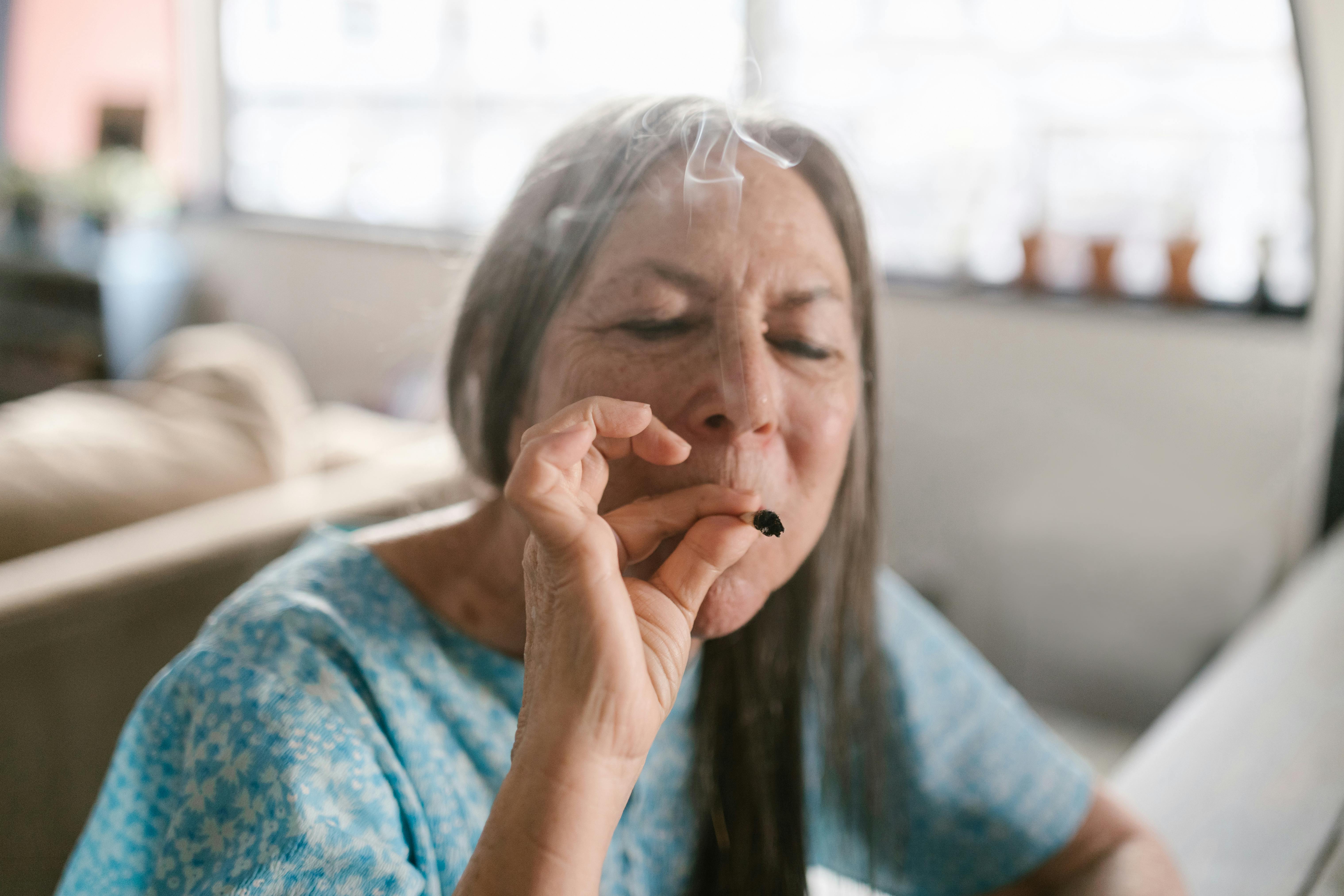 Photo of Person Holding Water Bong · Free Stock Photo