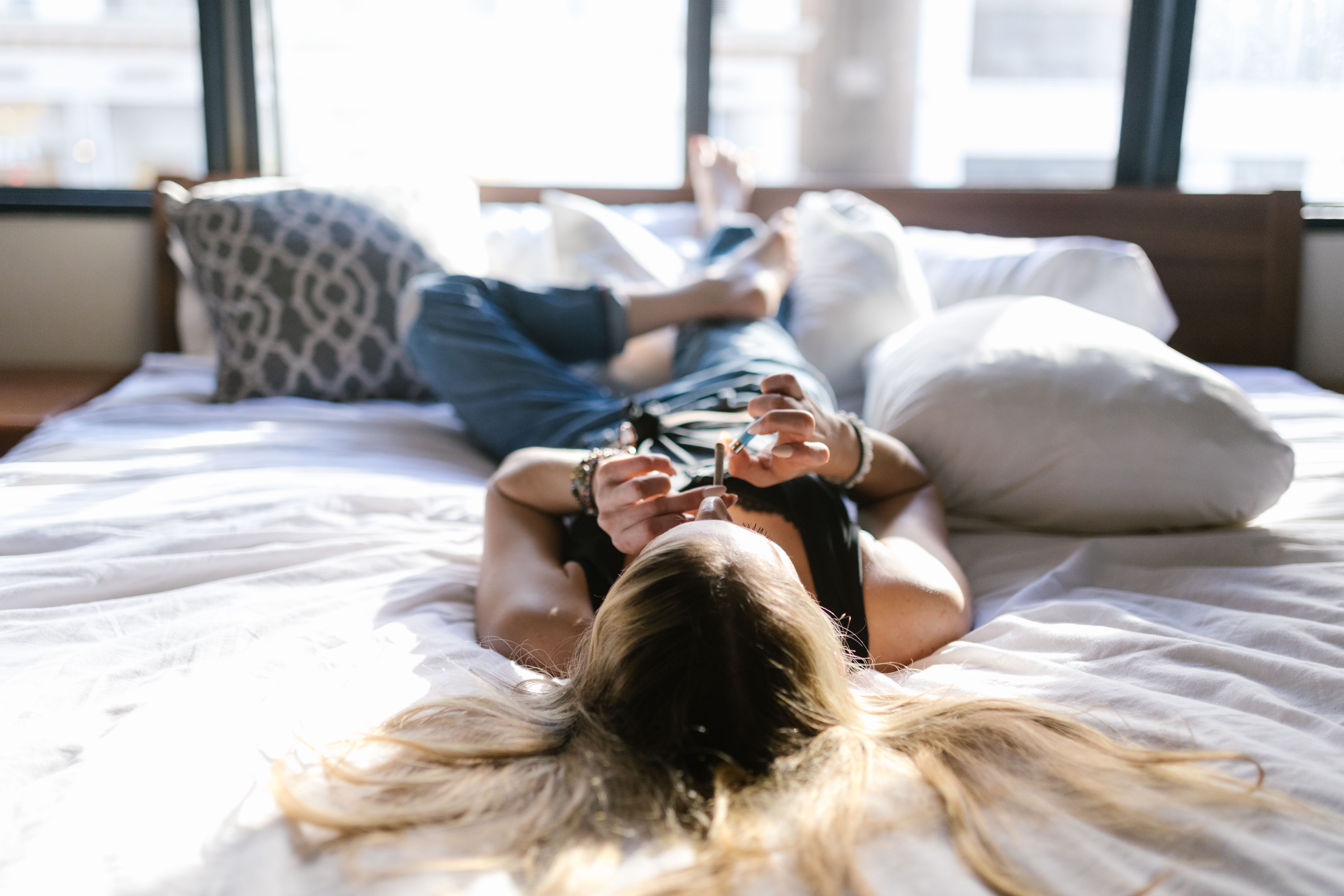 Person in Blue Jeans and Yellow Socks Lying Down on the Bed · Free ...